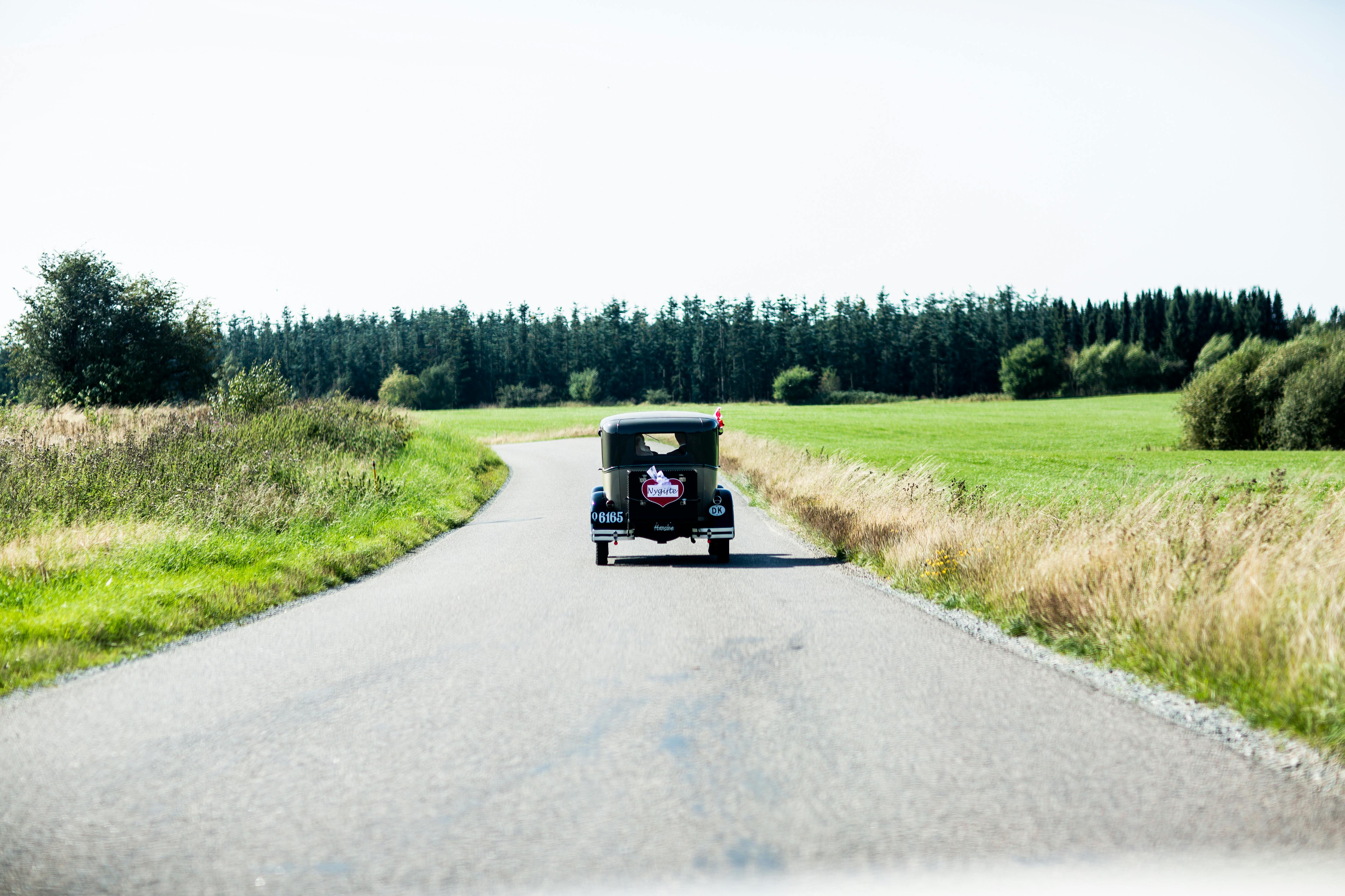 Vintage Car on Road · Free Stock Photo