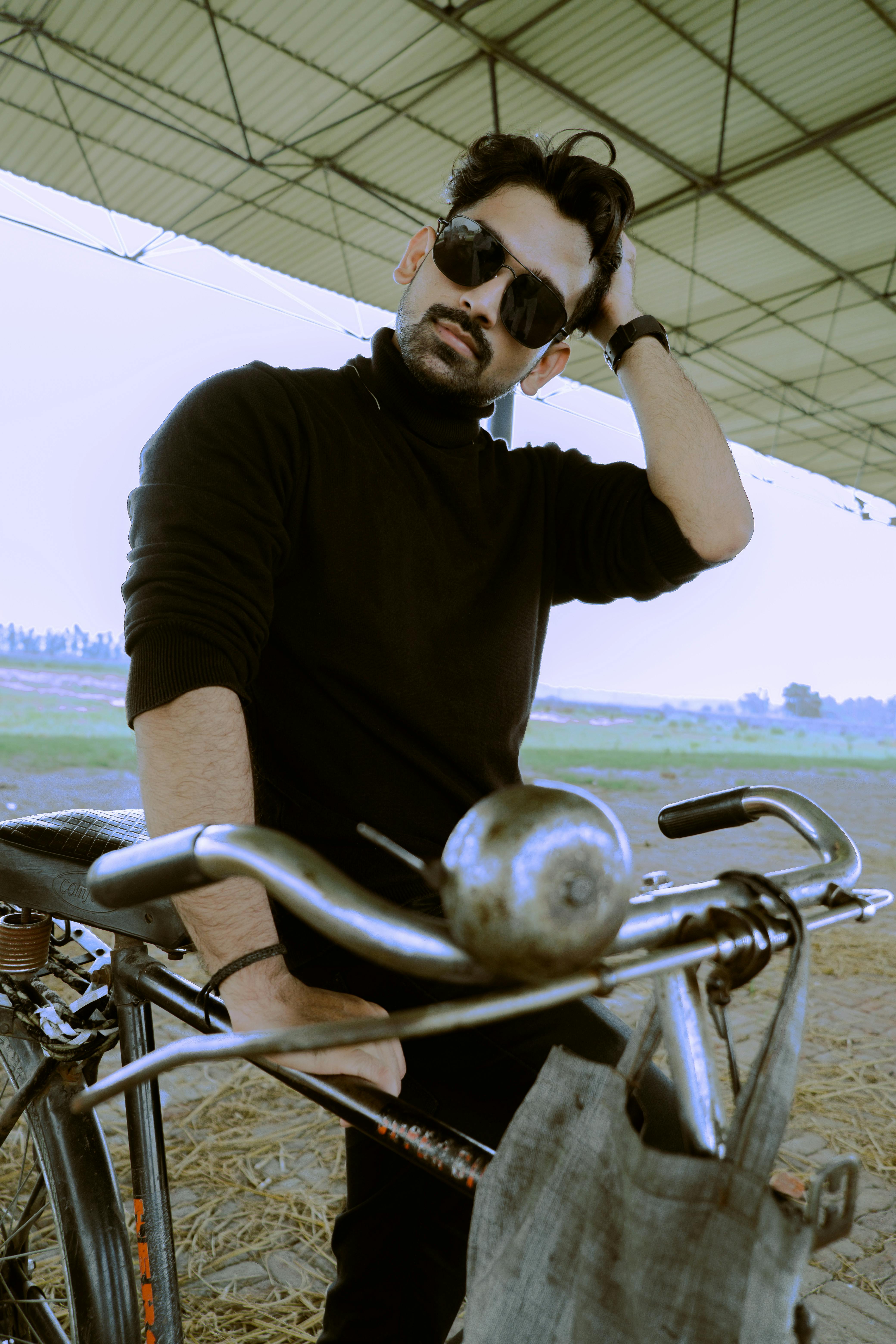 Man Posing by Railing · Free Stock Photo