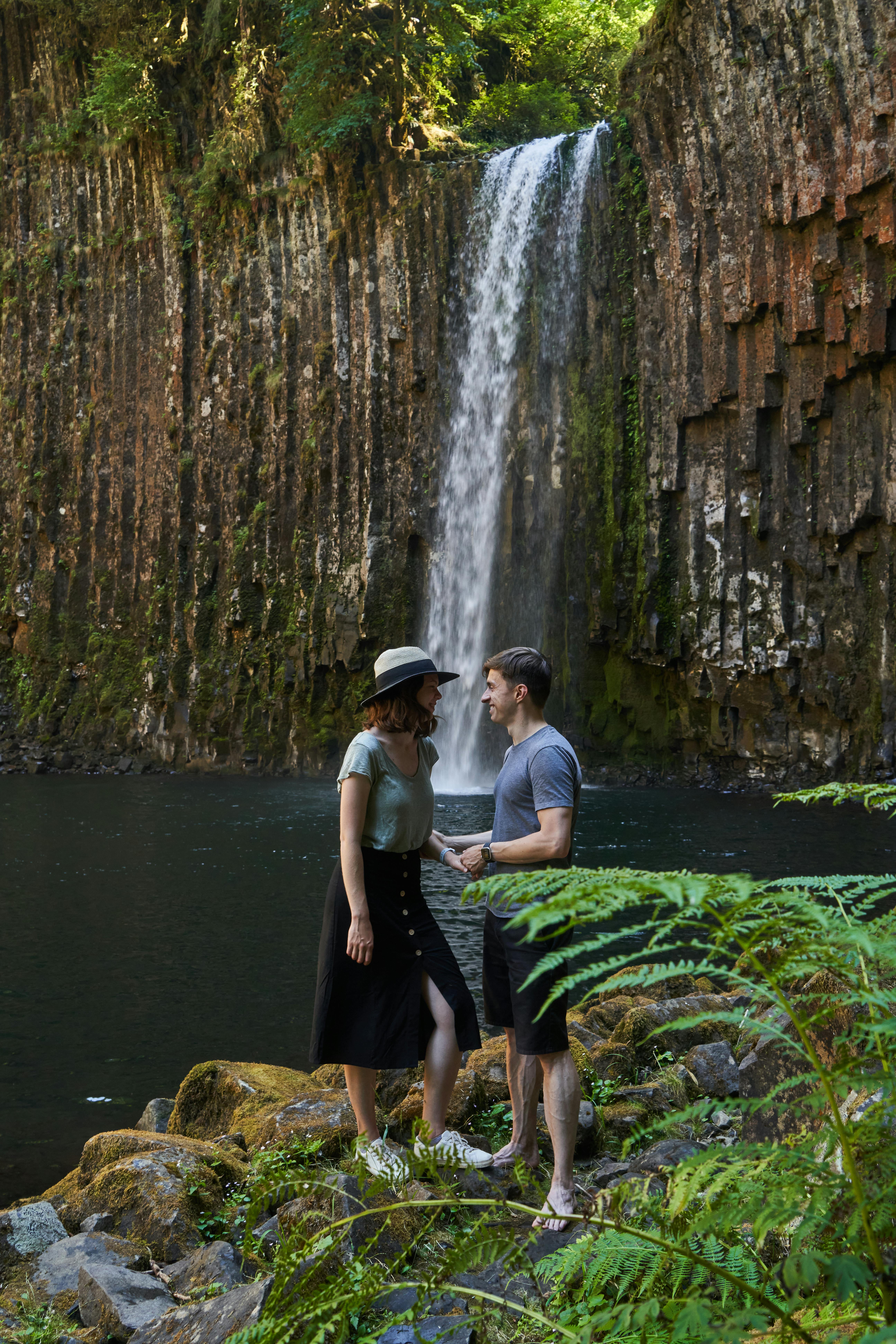 A Couple Standing Near a Waterfall · Free Stock Photo