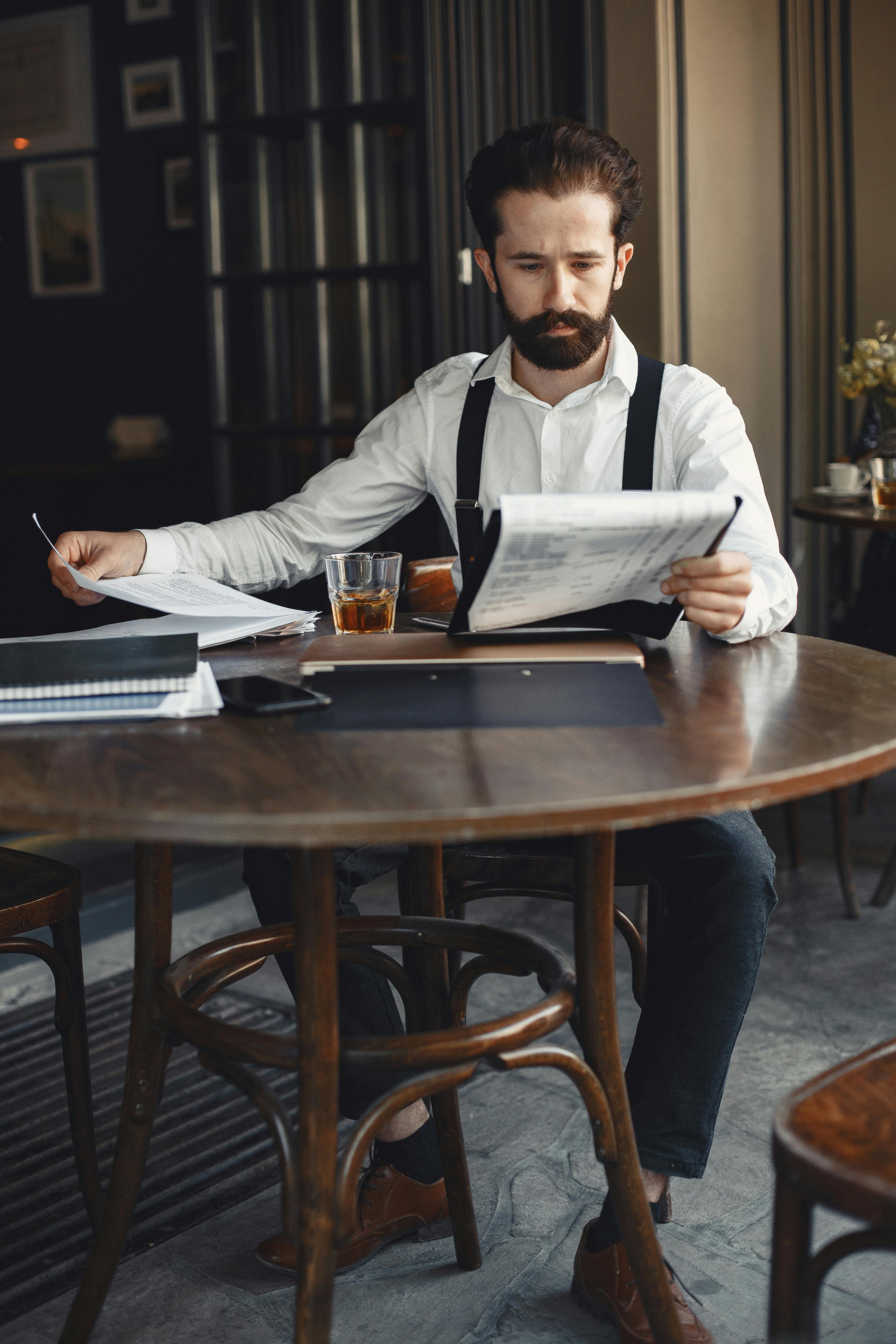 Man Reading at the Table · Free Stock Photo