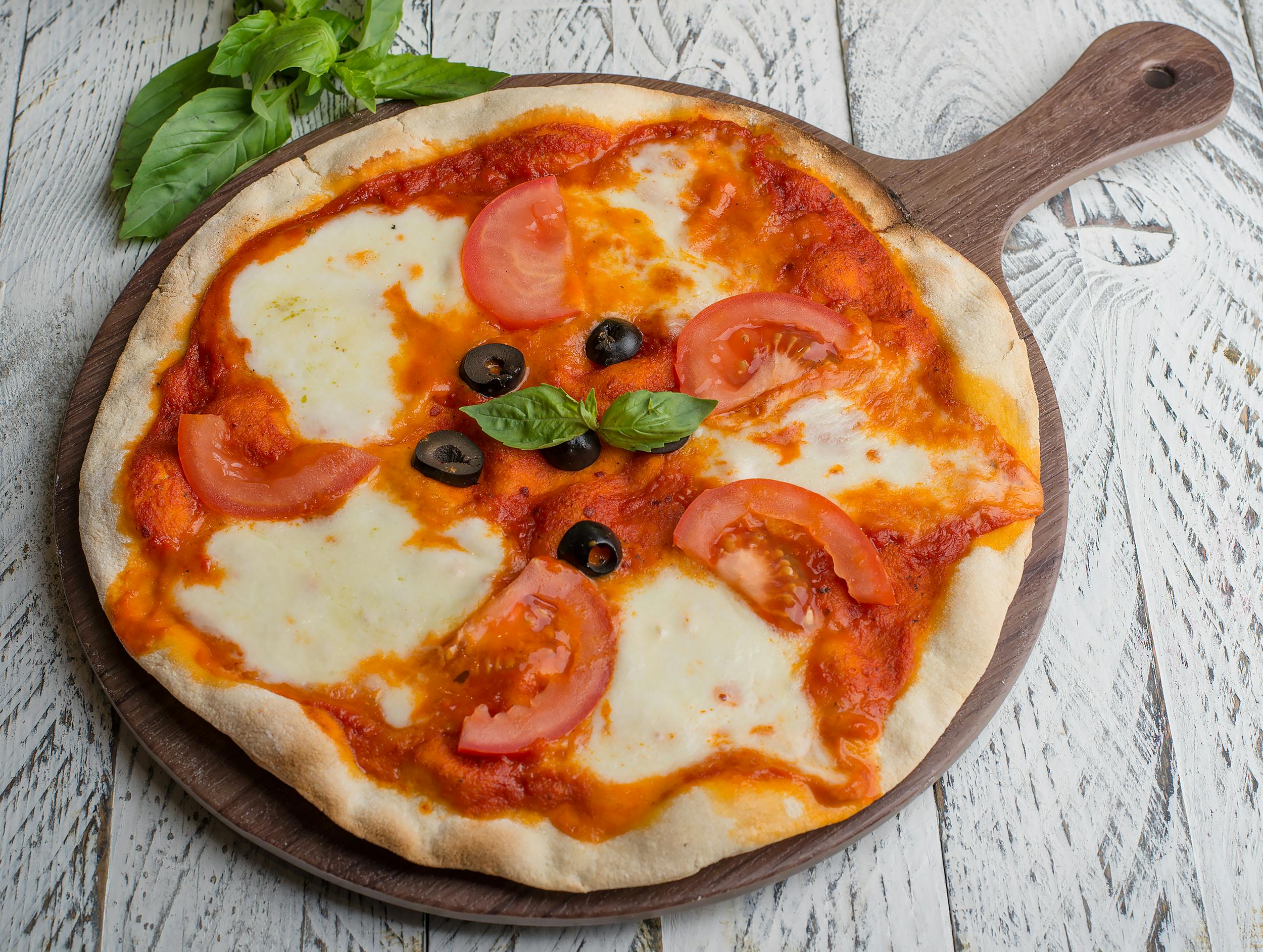 Pizza with Tomatoes and Cheese · Free Stock Photo