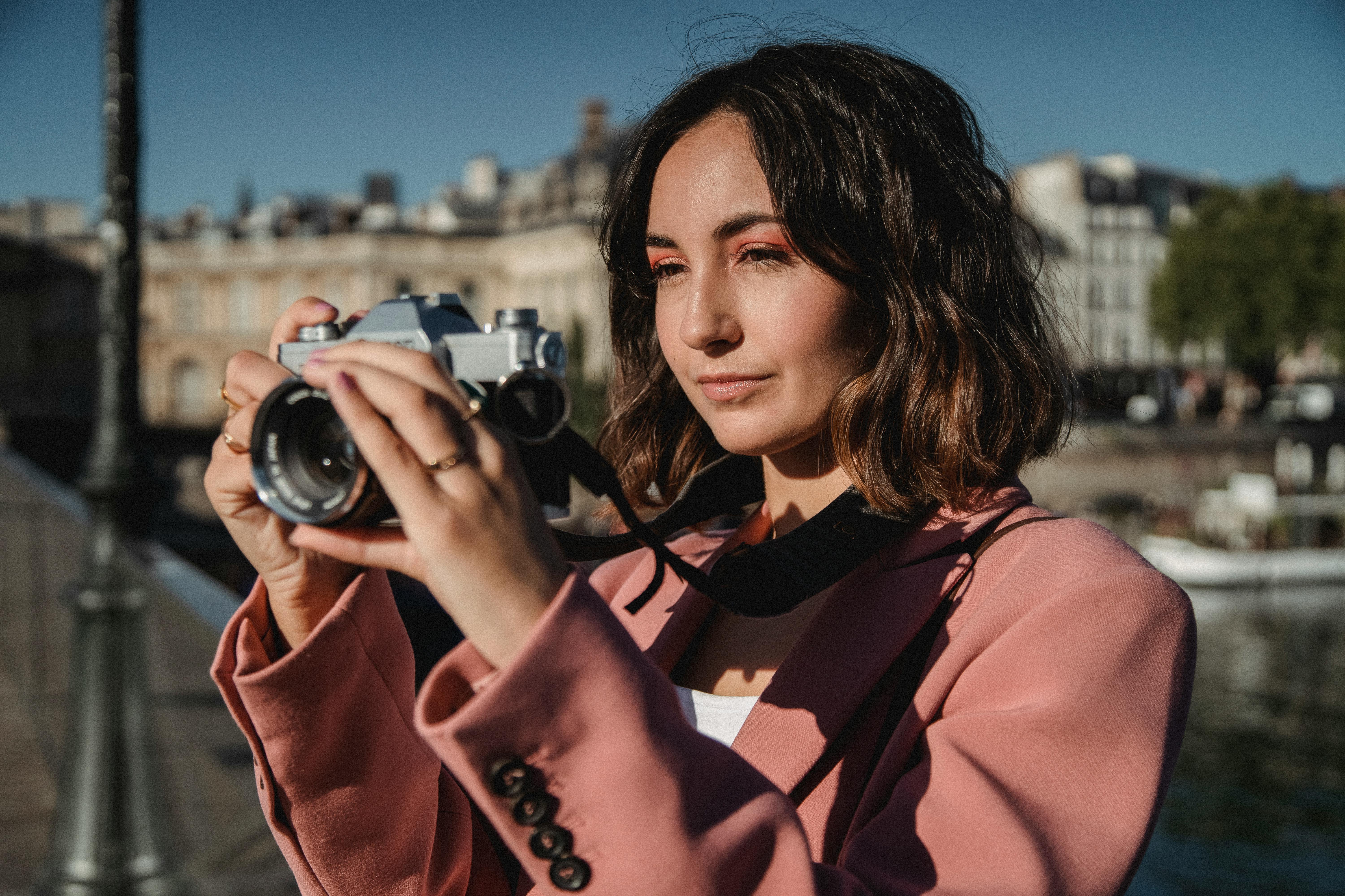 Woman Holding a Camera · Free Stock Photo