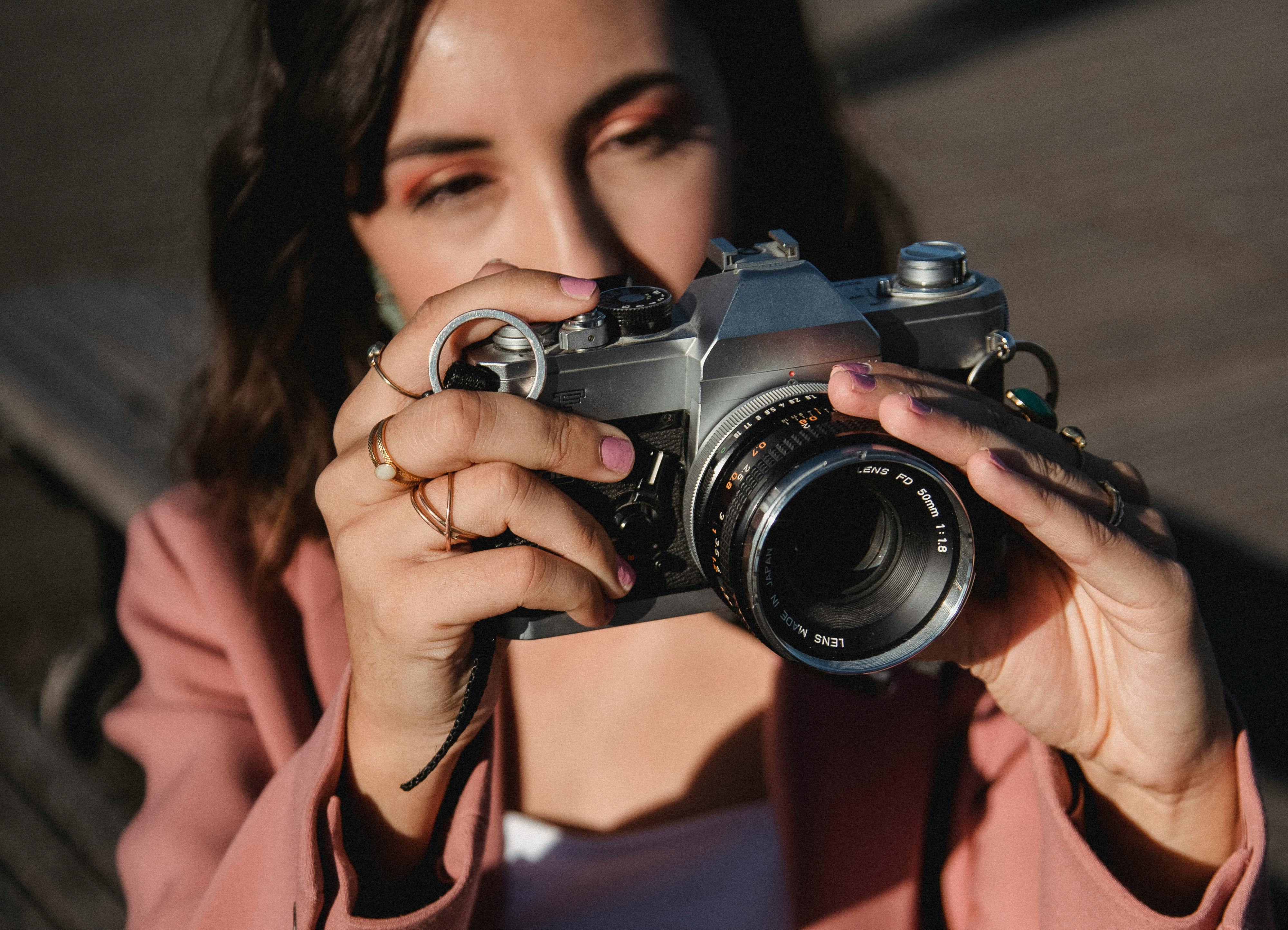 Woman Holding Black Camera · Free Stock Photo
