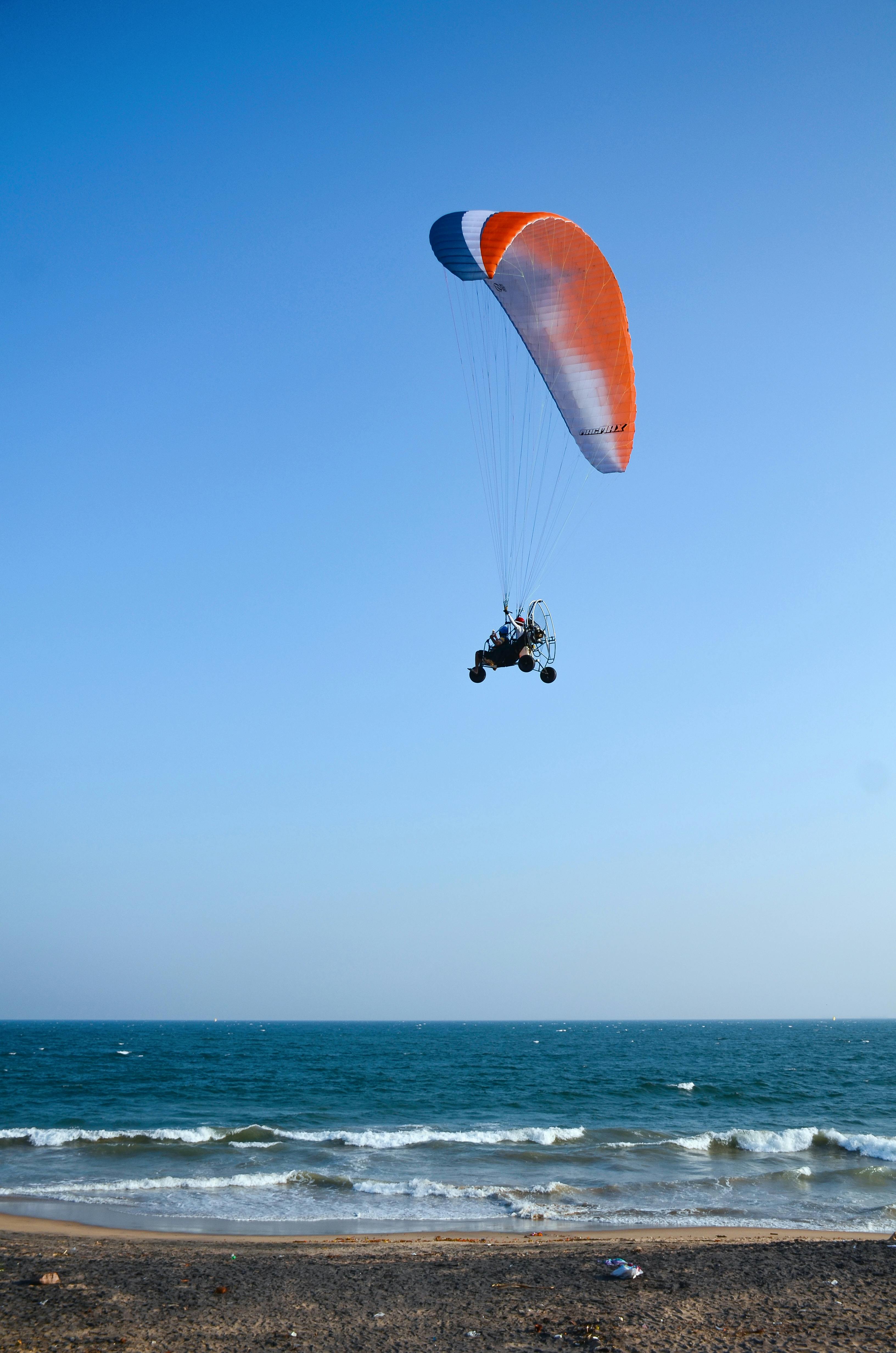 Person Riding a Parachute · Free Stock Photo