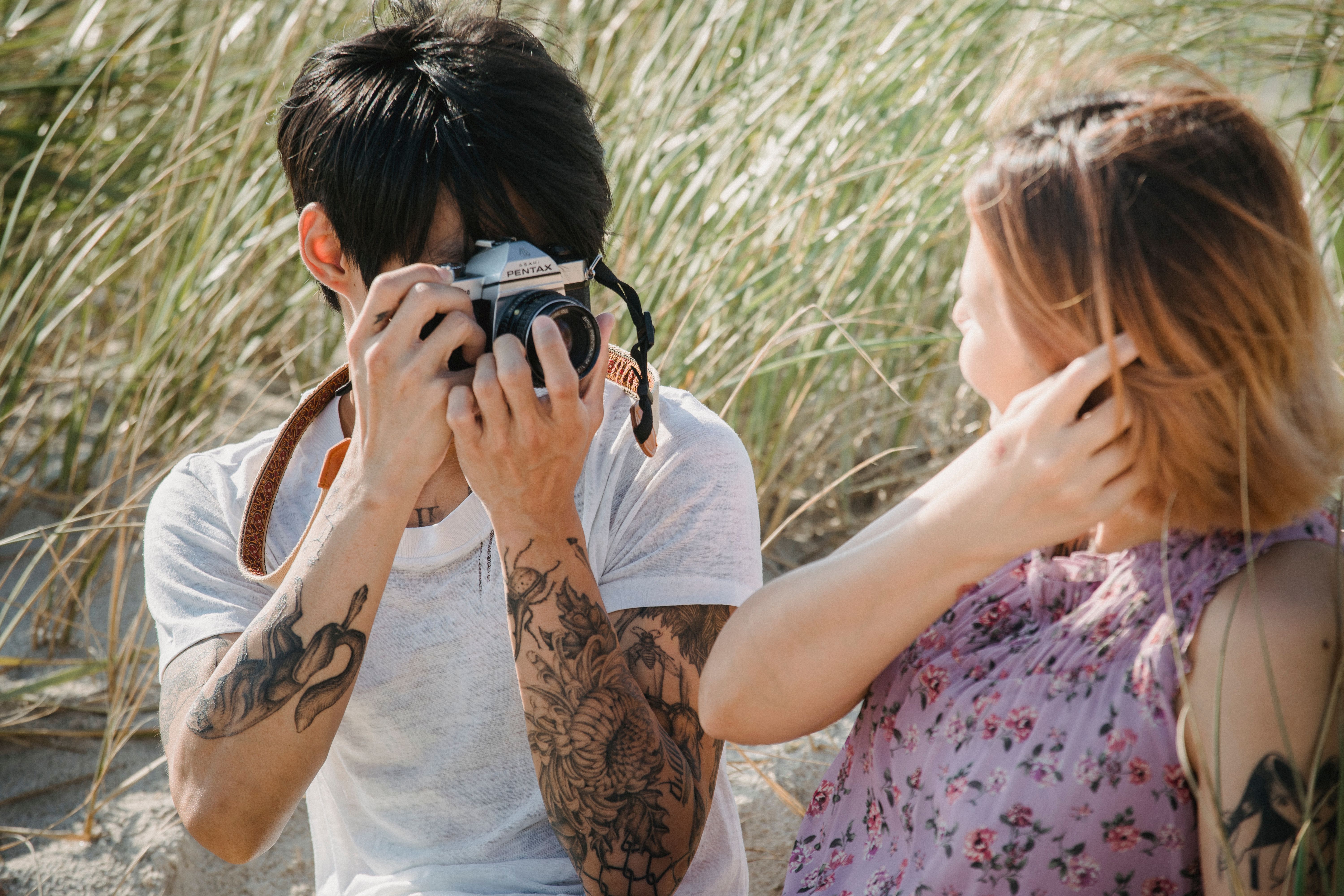Man Taking a Photo of a Woman · Free Stock Photo