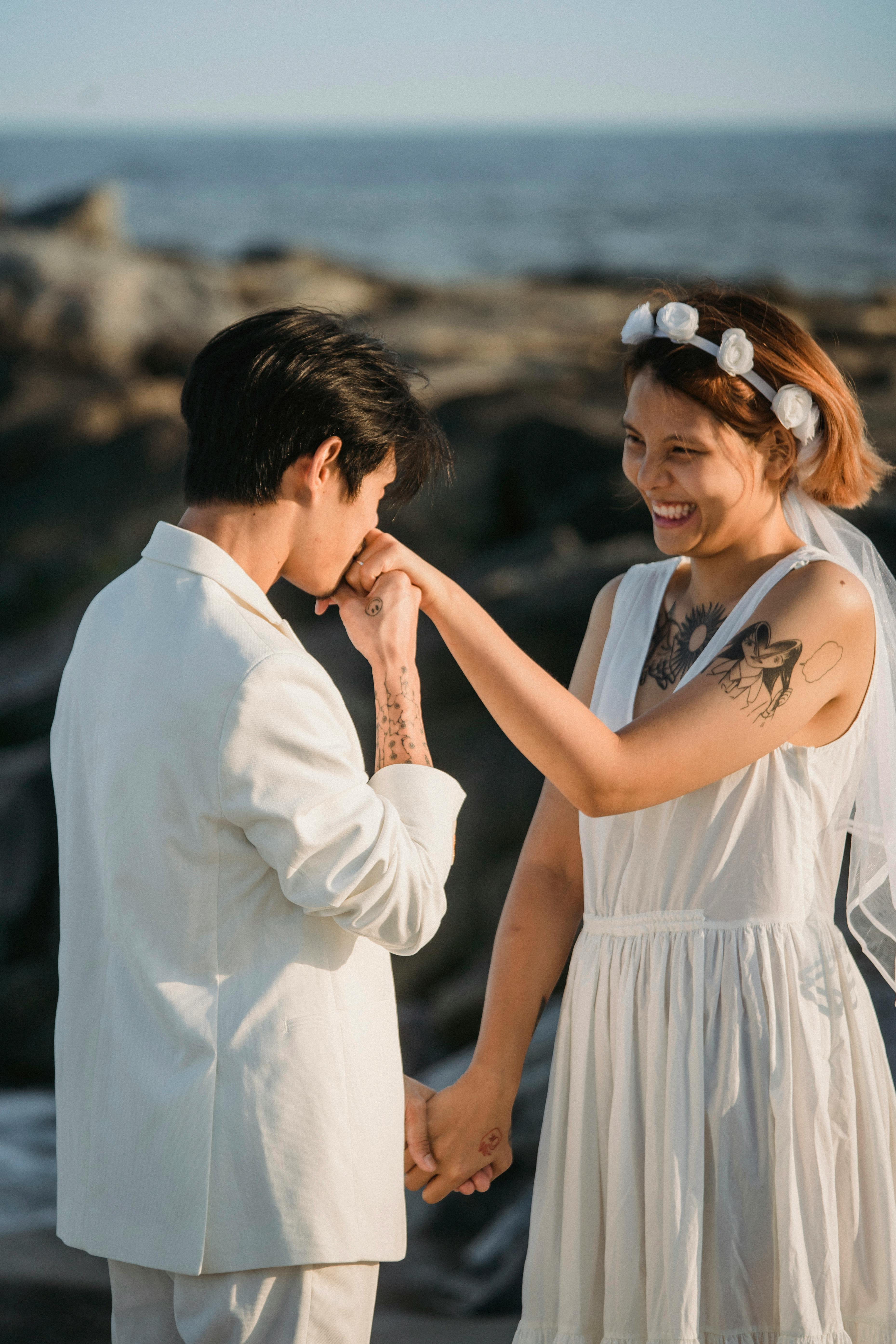 Man in Suit Kissing Woman's Hand · Free Stock Photo