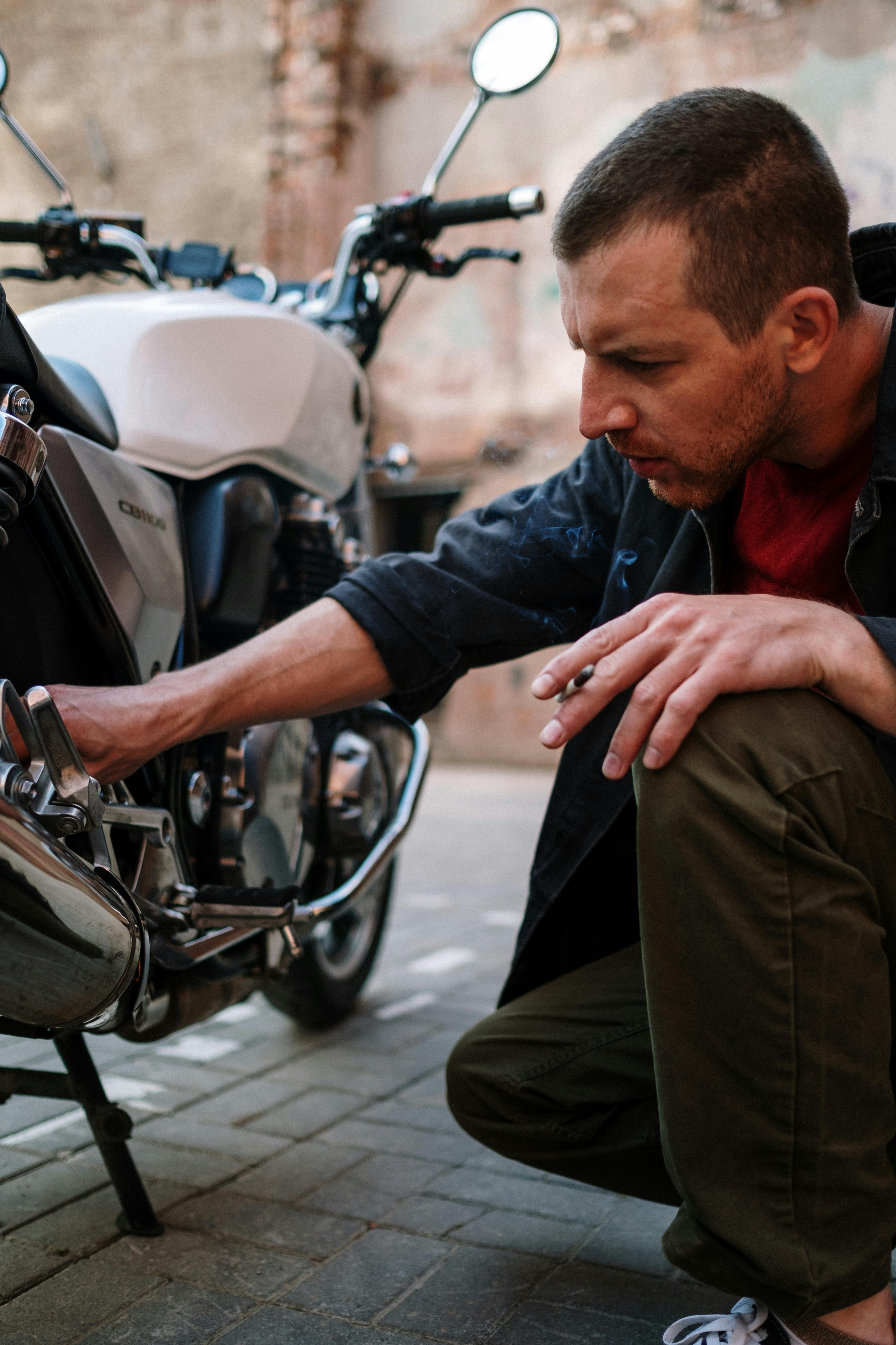 Man Fixing a Motorcycle · Free Stock Photo
