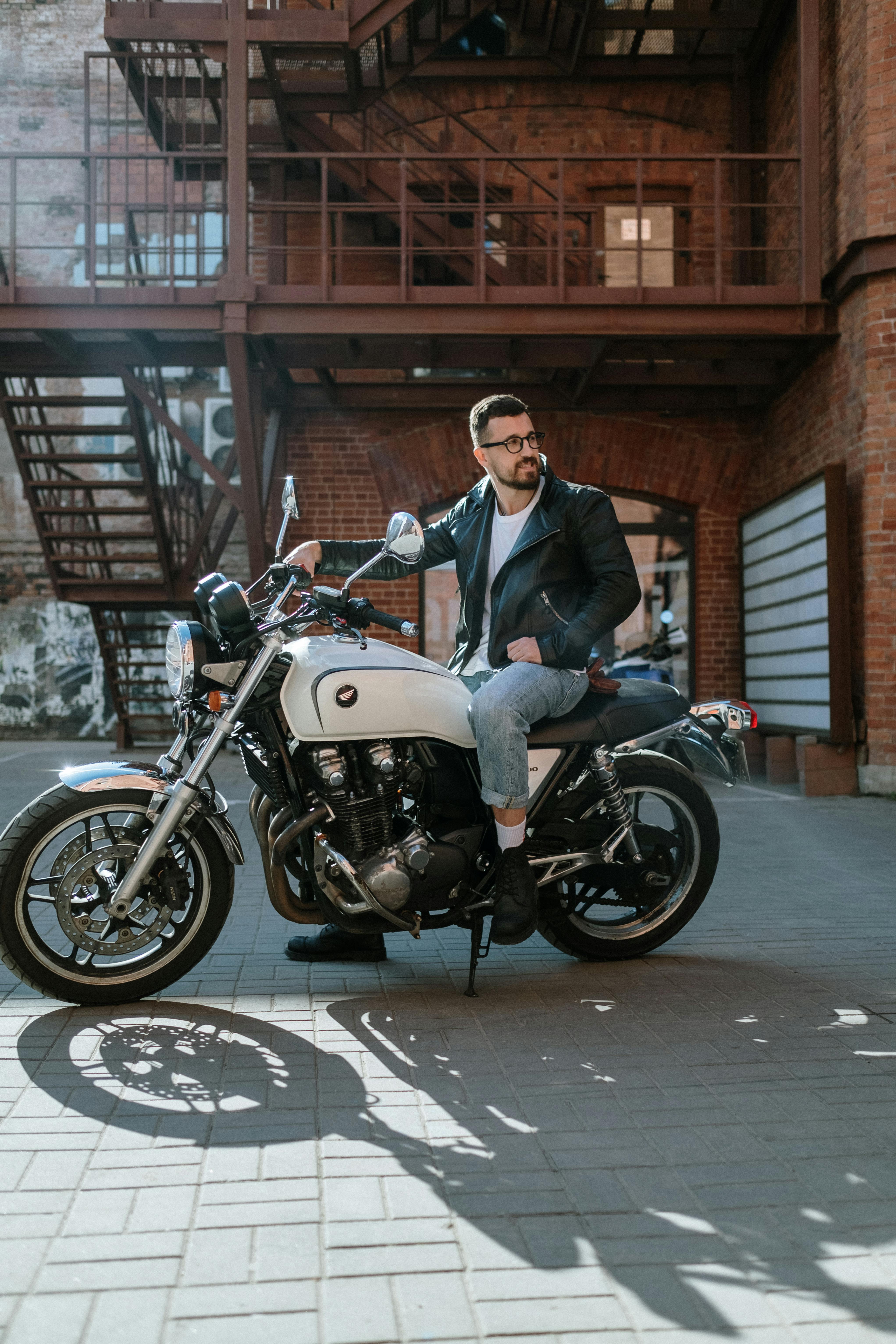 A Man Riding a Motorcycle · Free Stock Photo