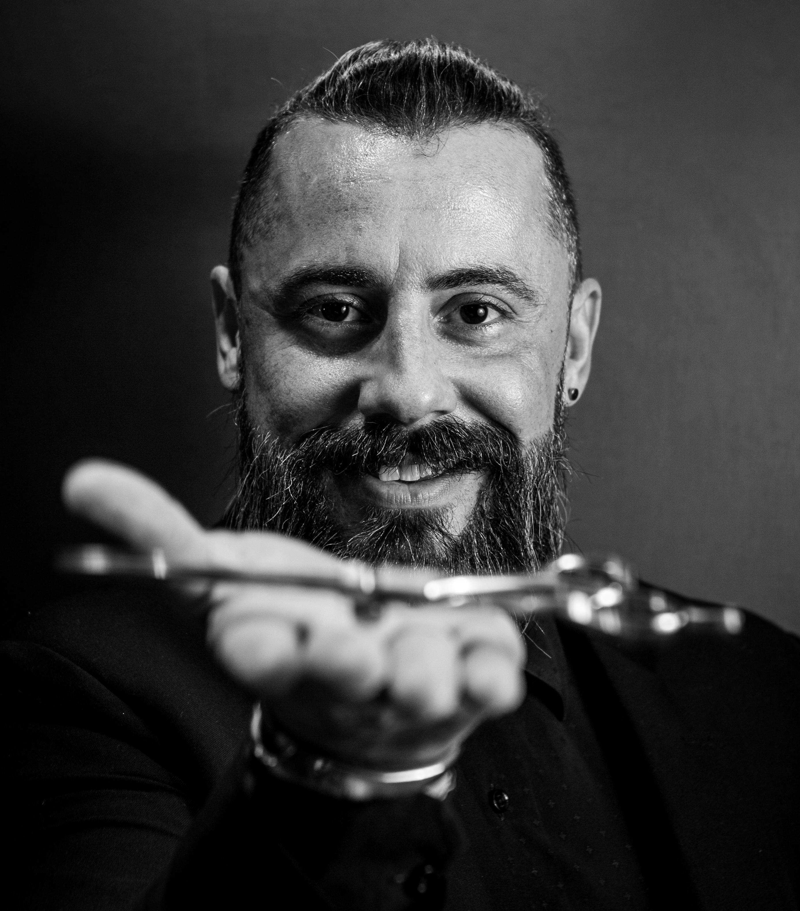 Smiling Man with Scissors on Hand · Free Stock Photo