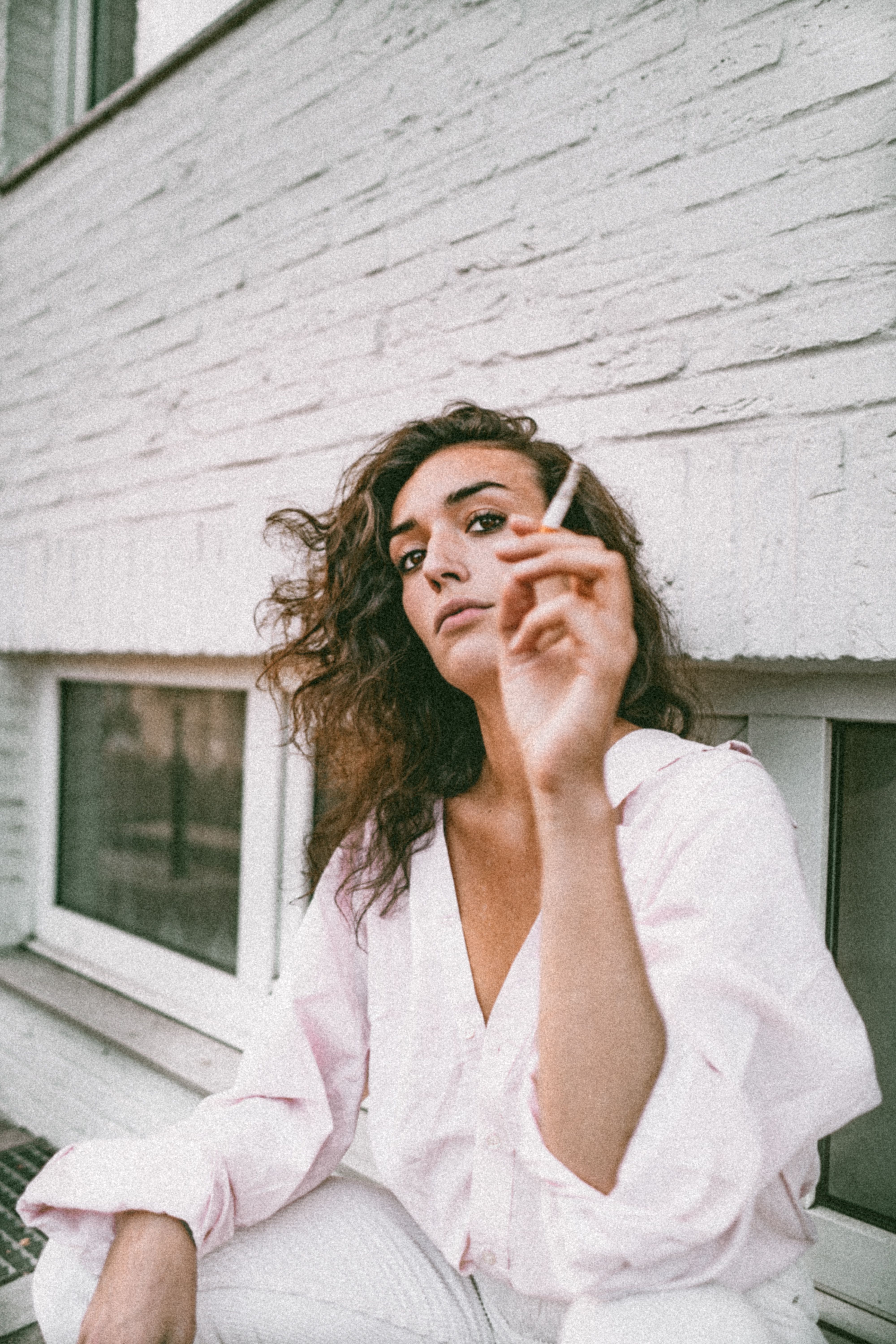 A Woman Lighting Up a Cigarette · Free Stock Photo