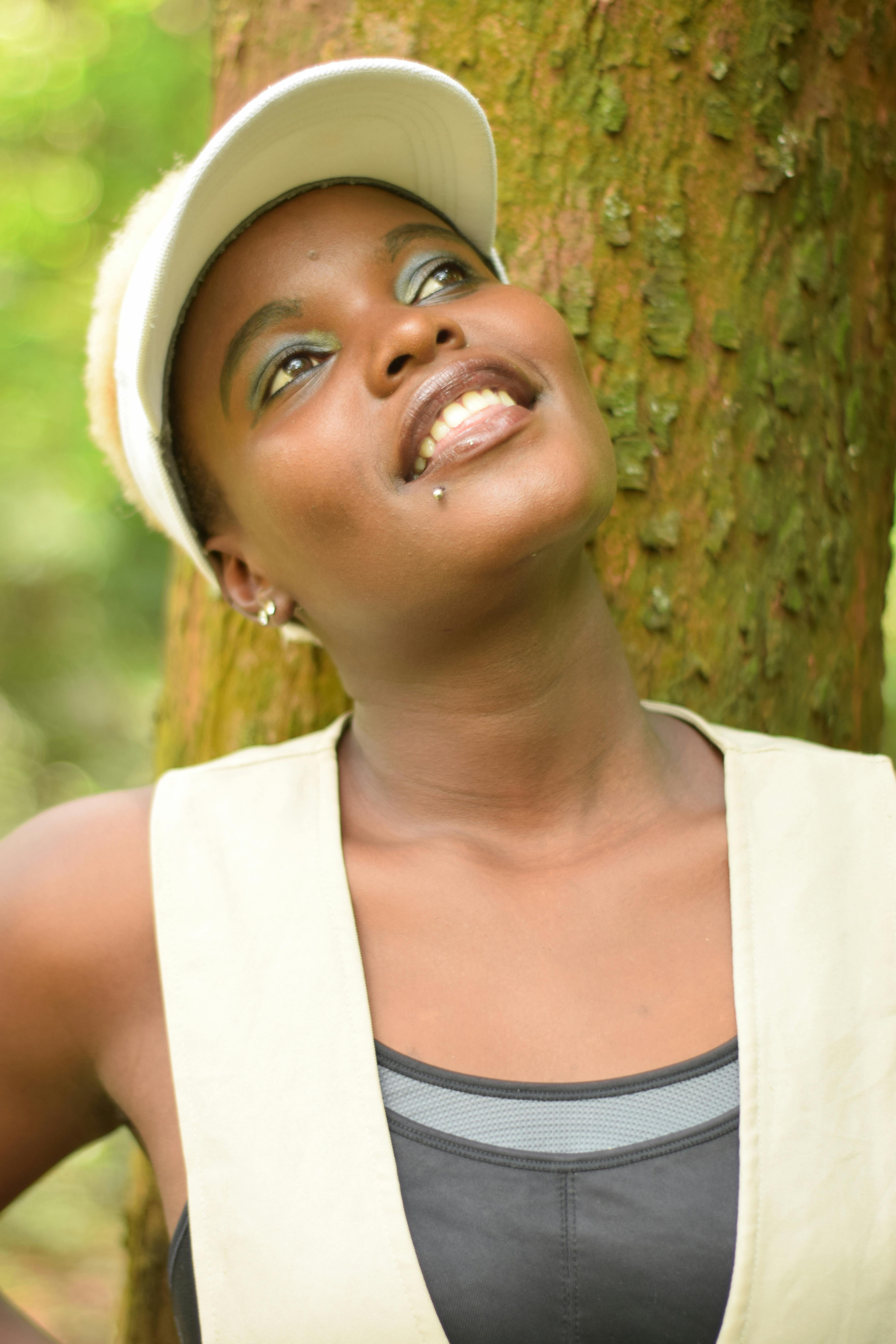 Woman Sitting on Tree Trunk · Free Stock Photo