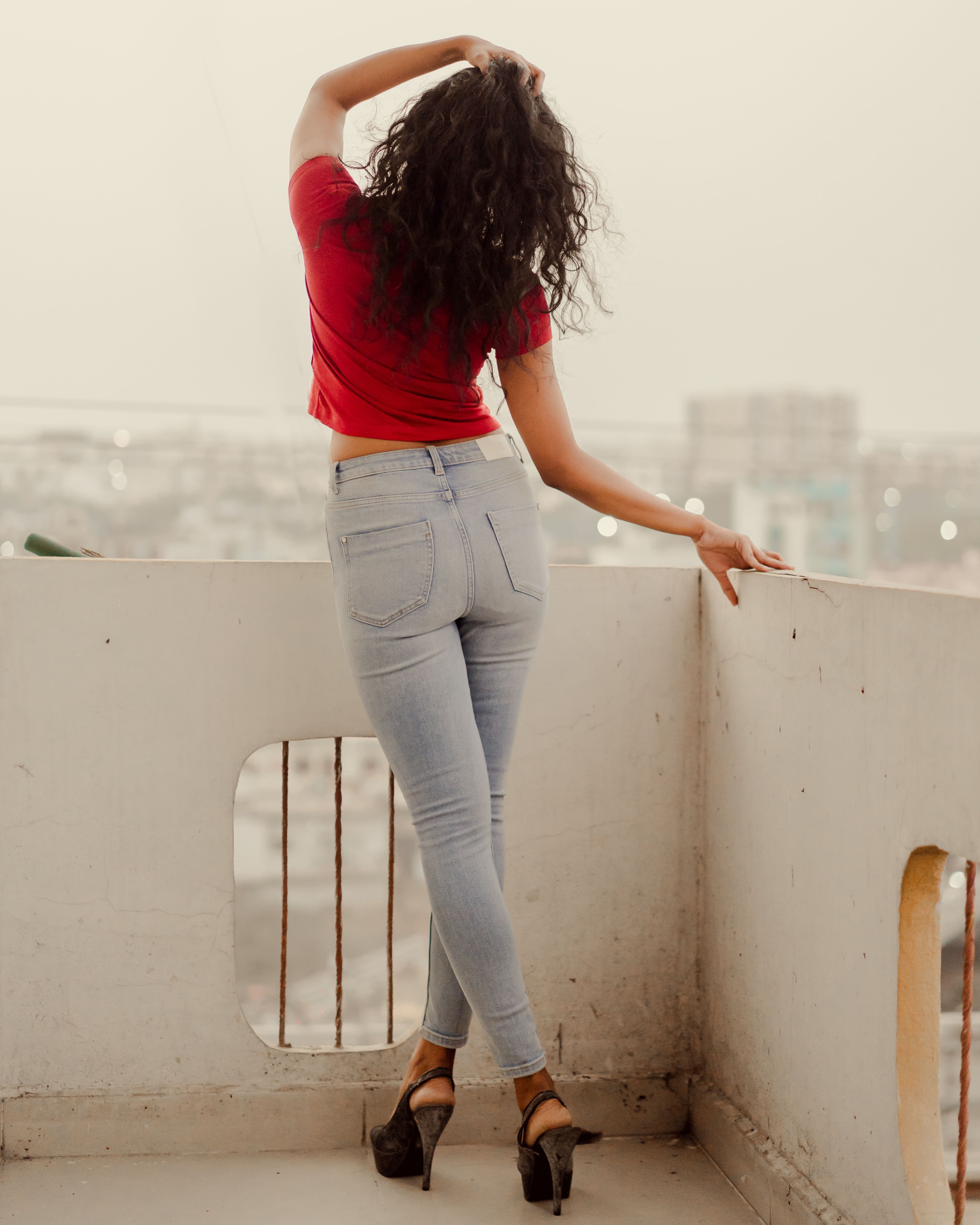 Smiling Woman Standing With Hands In Pockets Free Stock Photo