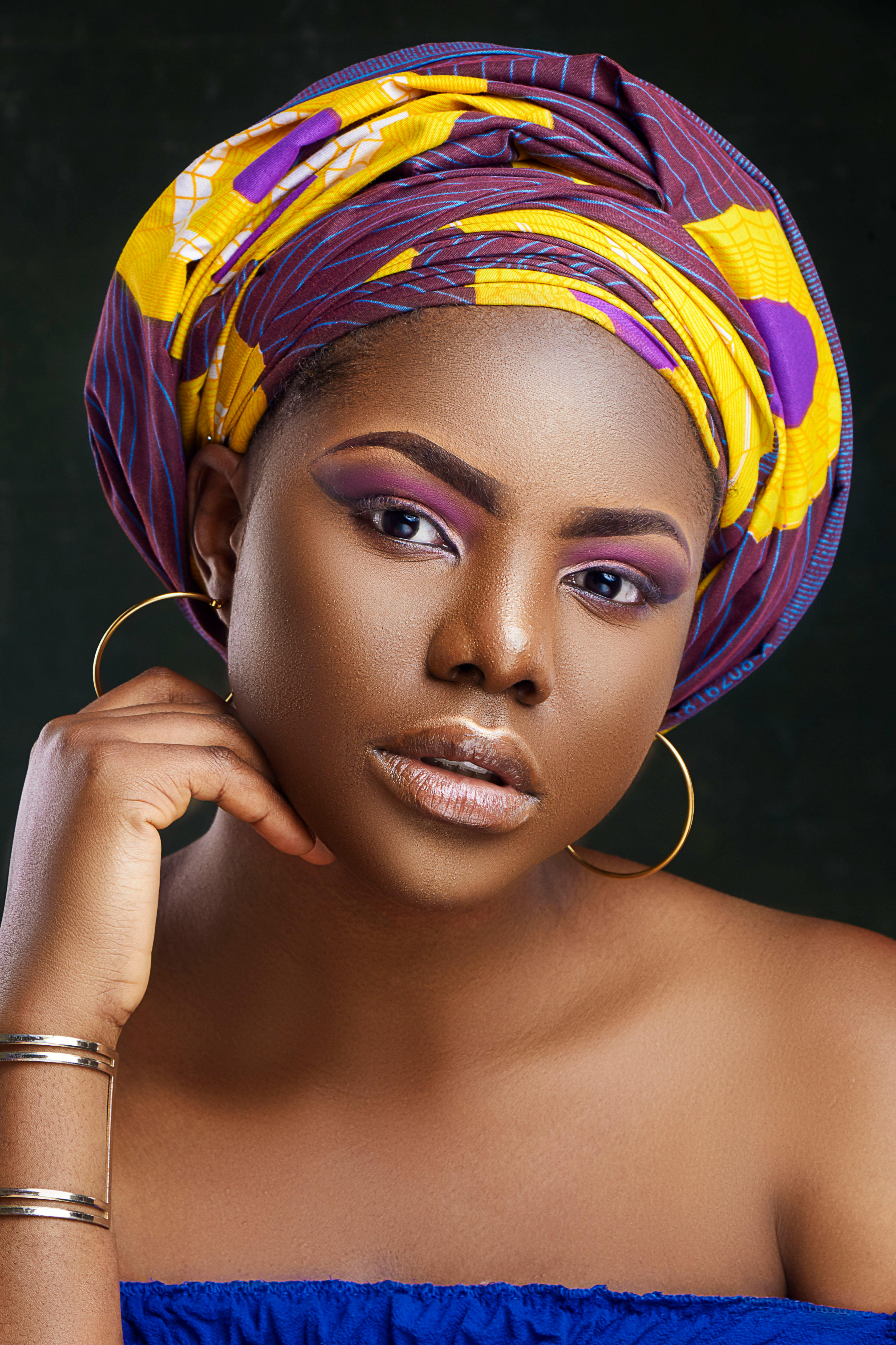 Graceful ethnic model with white flower behind back · Free Stock Photo