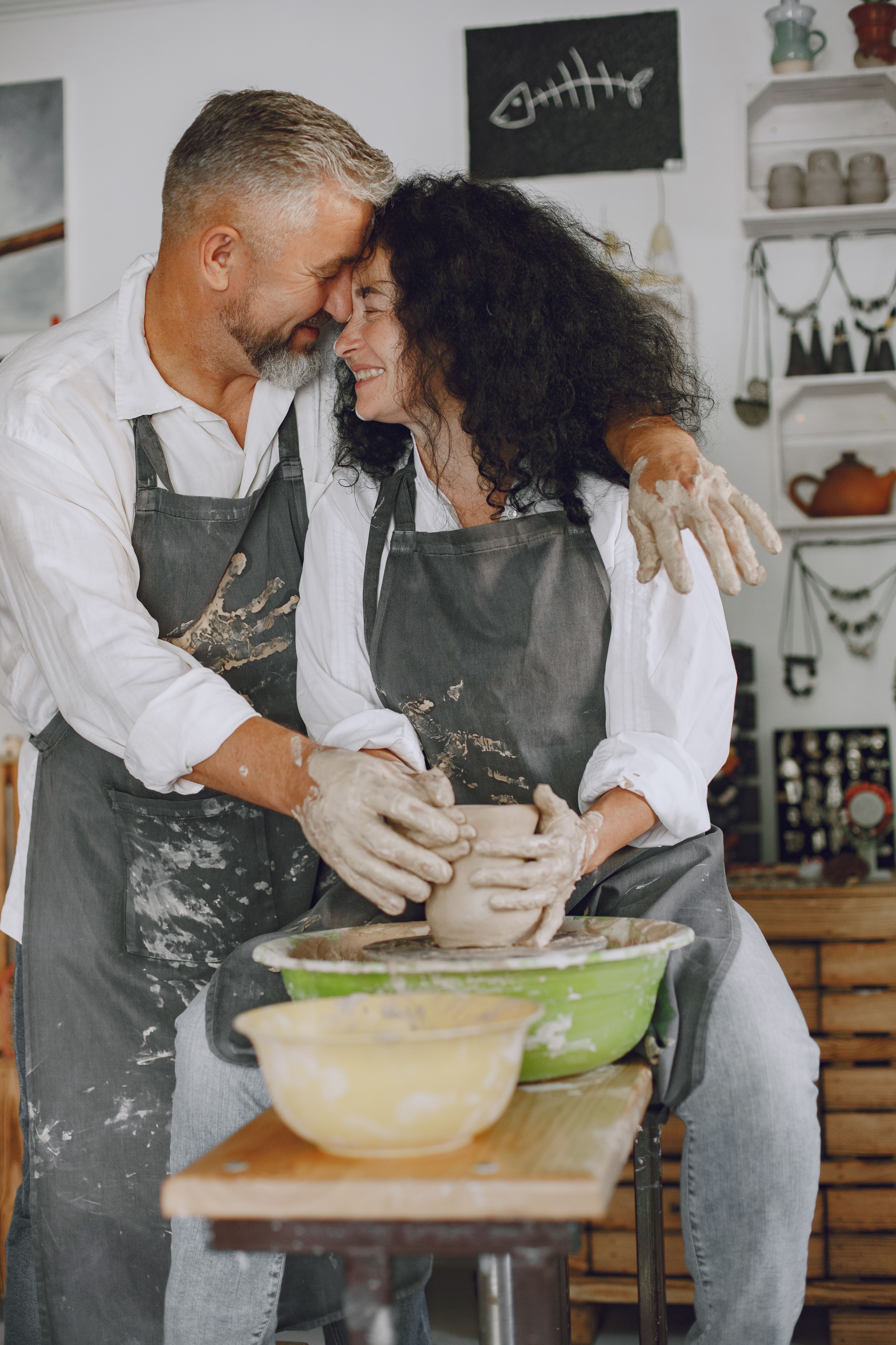 Couple Working Together in Clay · Free Stock Photo