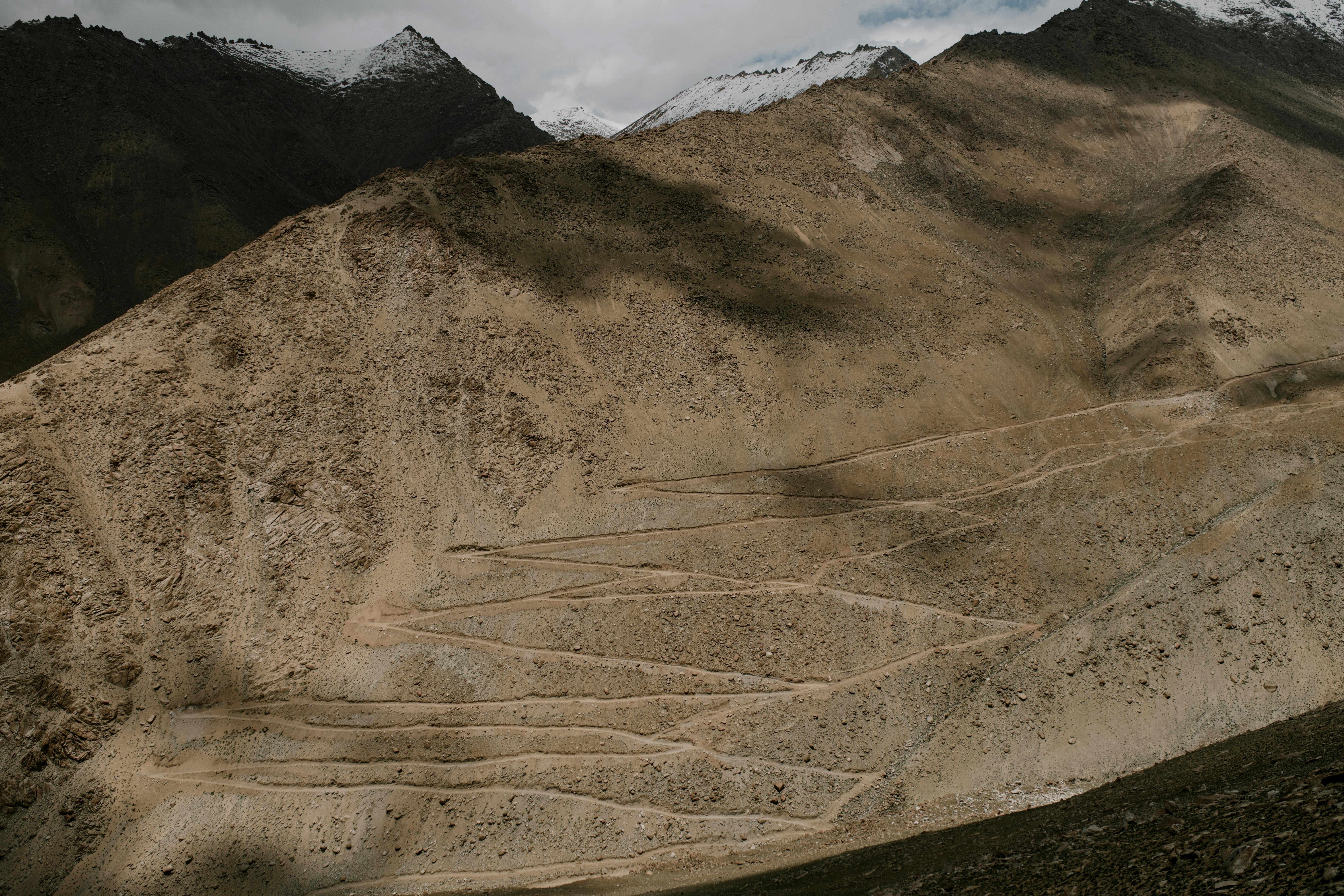Rocky terrain with tracks on surface · Free Stock Photo