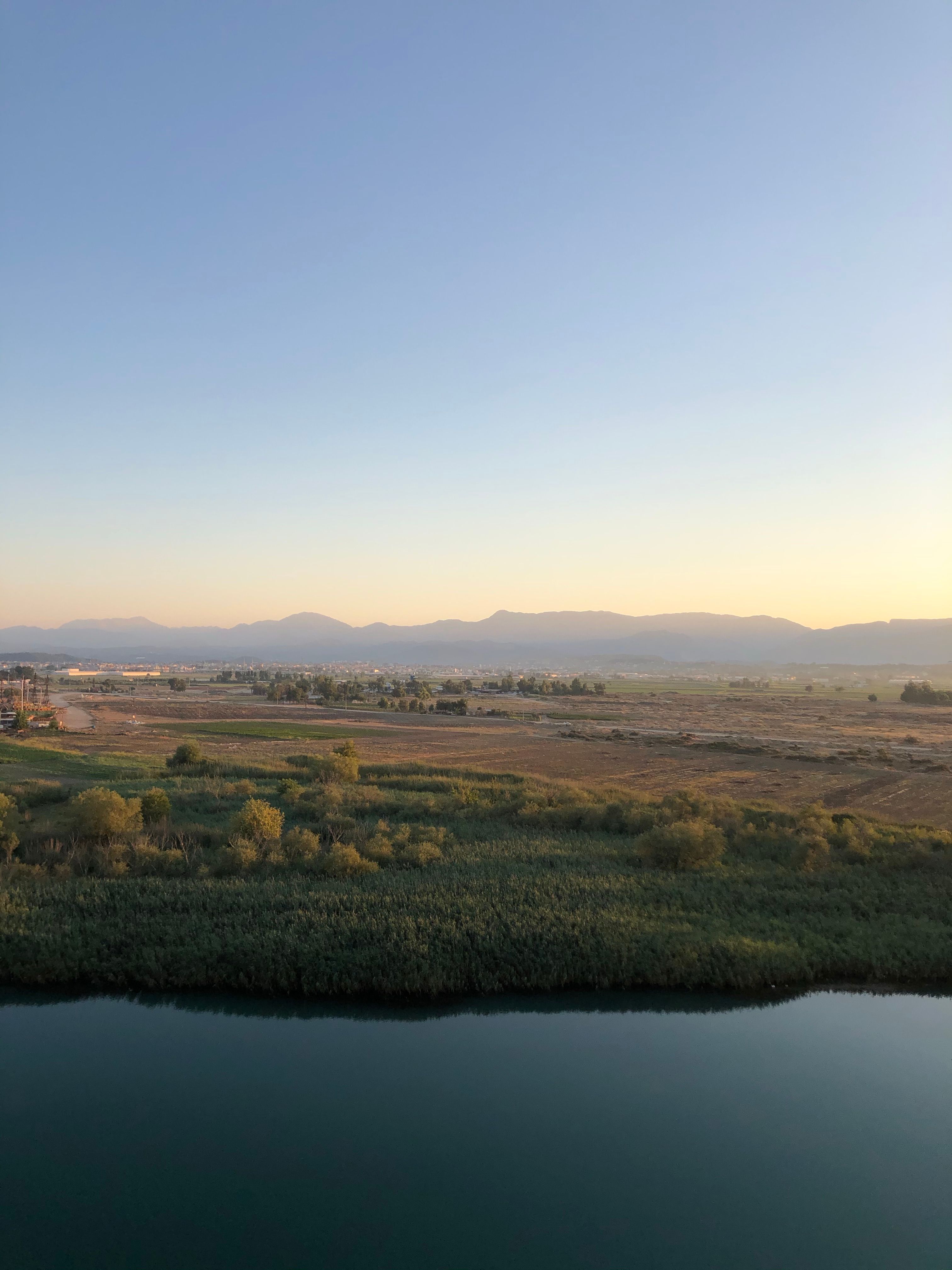 Sunrise over Plains with Lakes and Road · Free Stock Photo