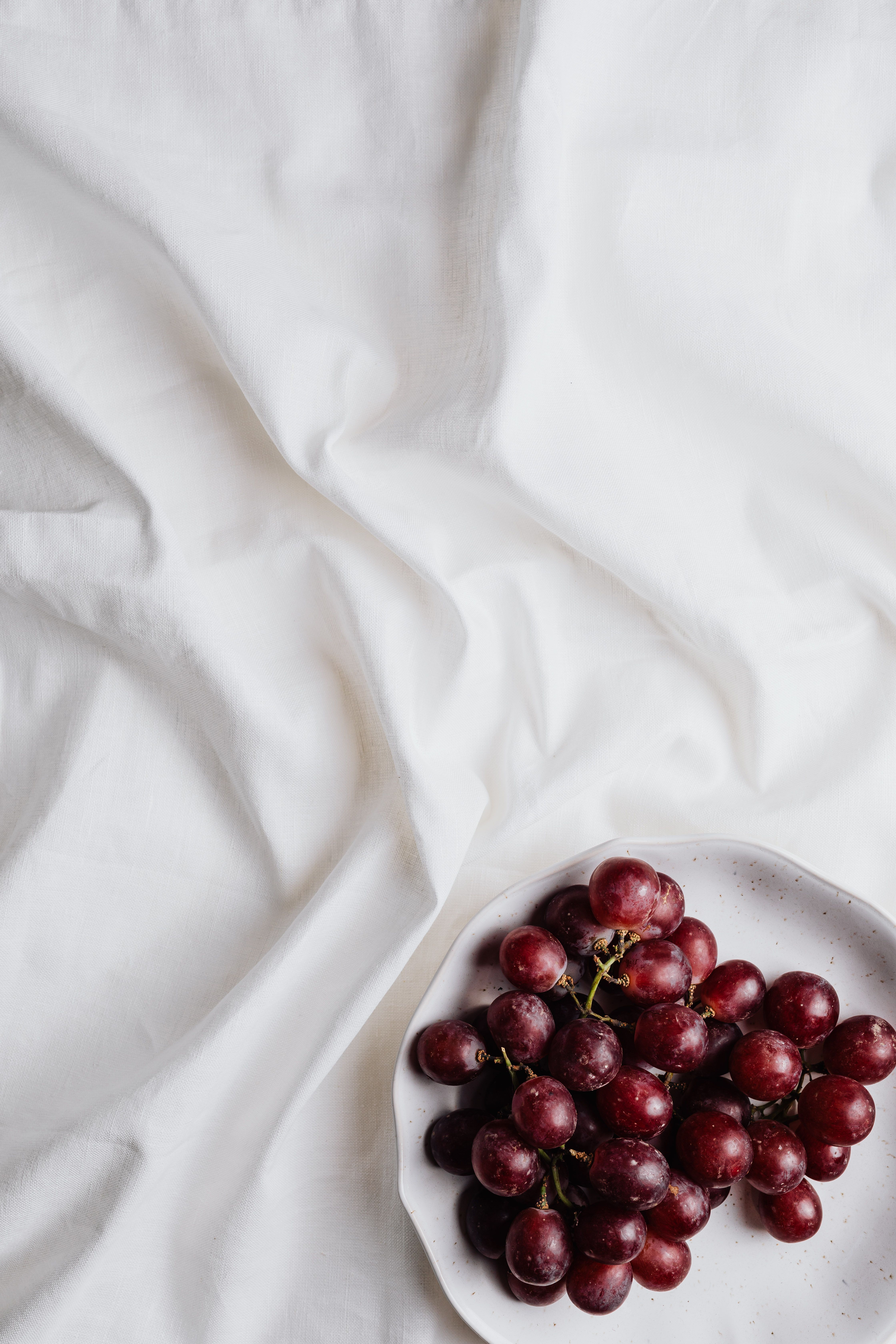 Plates of Grape on a White Surface · Free Stock Photo