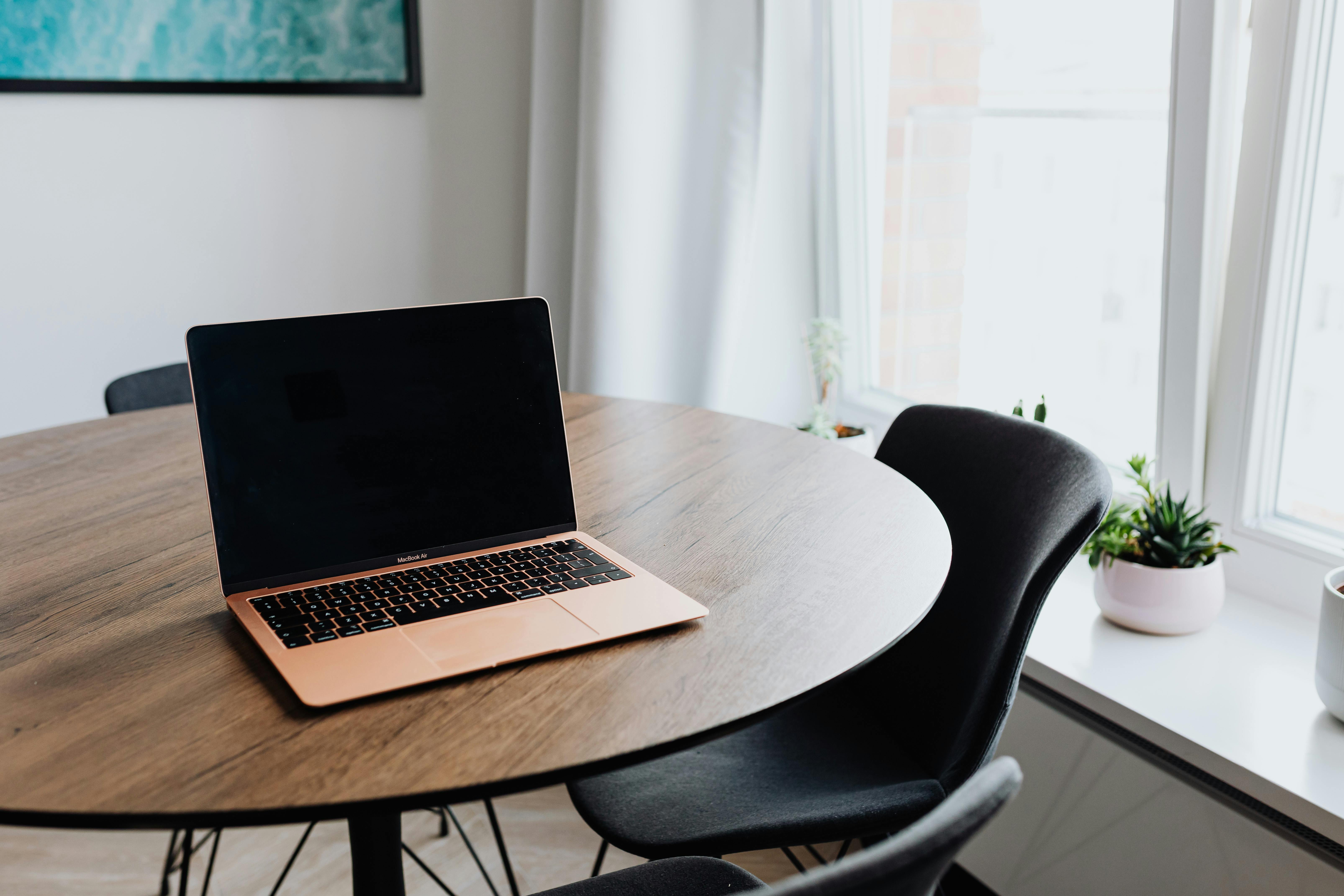 Laptop on Wooden Table · Free Stock Photo