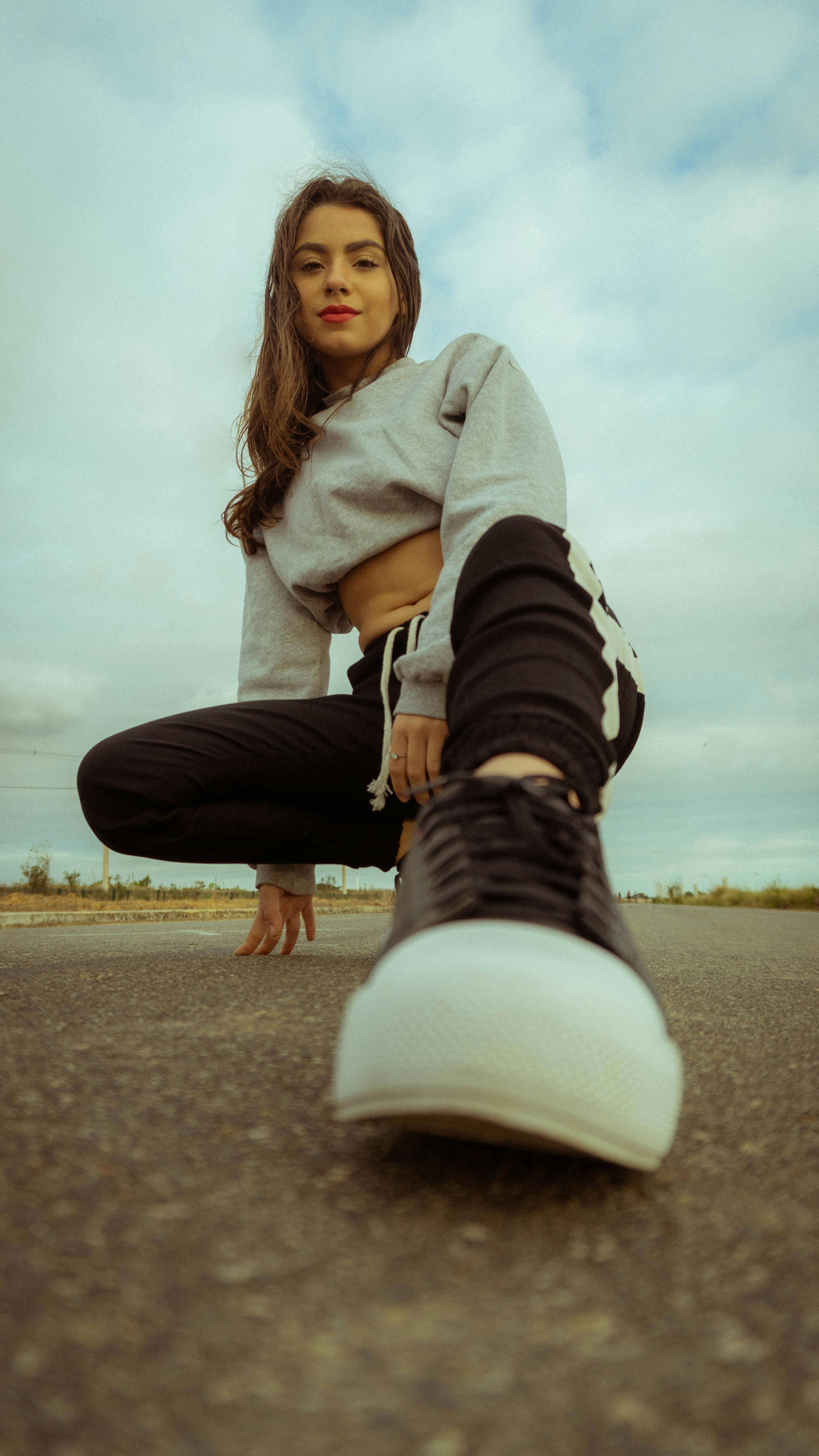 Photo of a Crouching Woman · Free Stock Photo