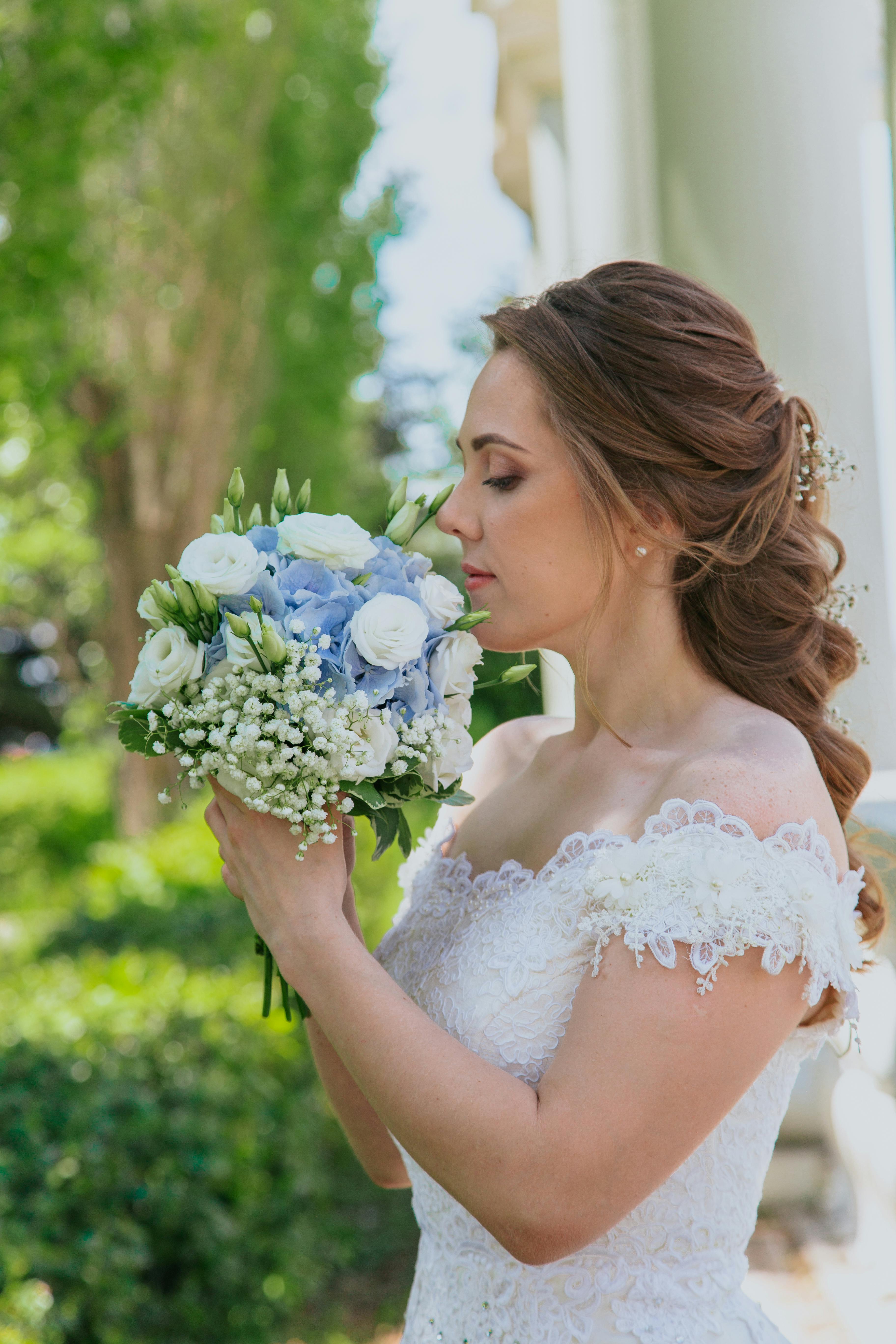 Bride with wedding ring and flowers · Free Stock Photo