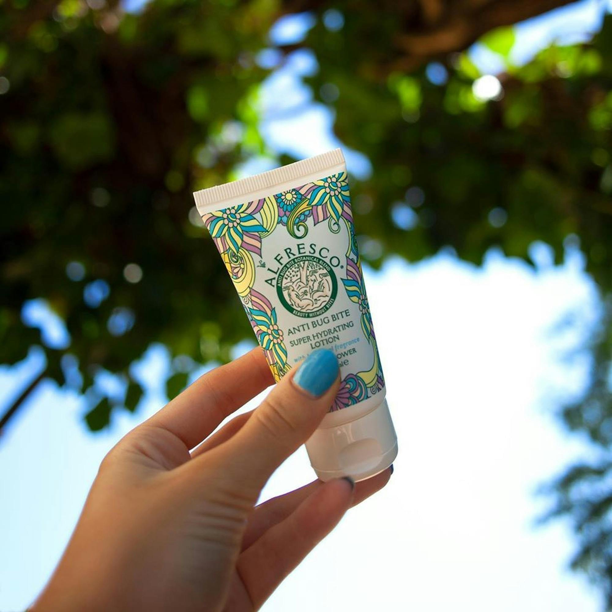 Hand Holding Anti Bug Bite Lotion · Free Stock Photo