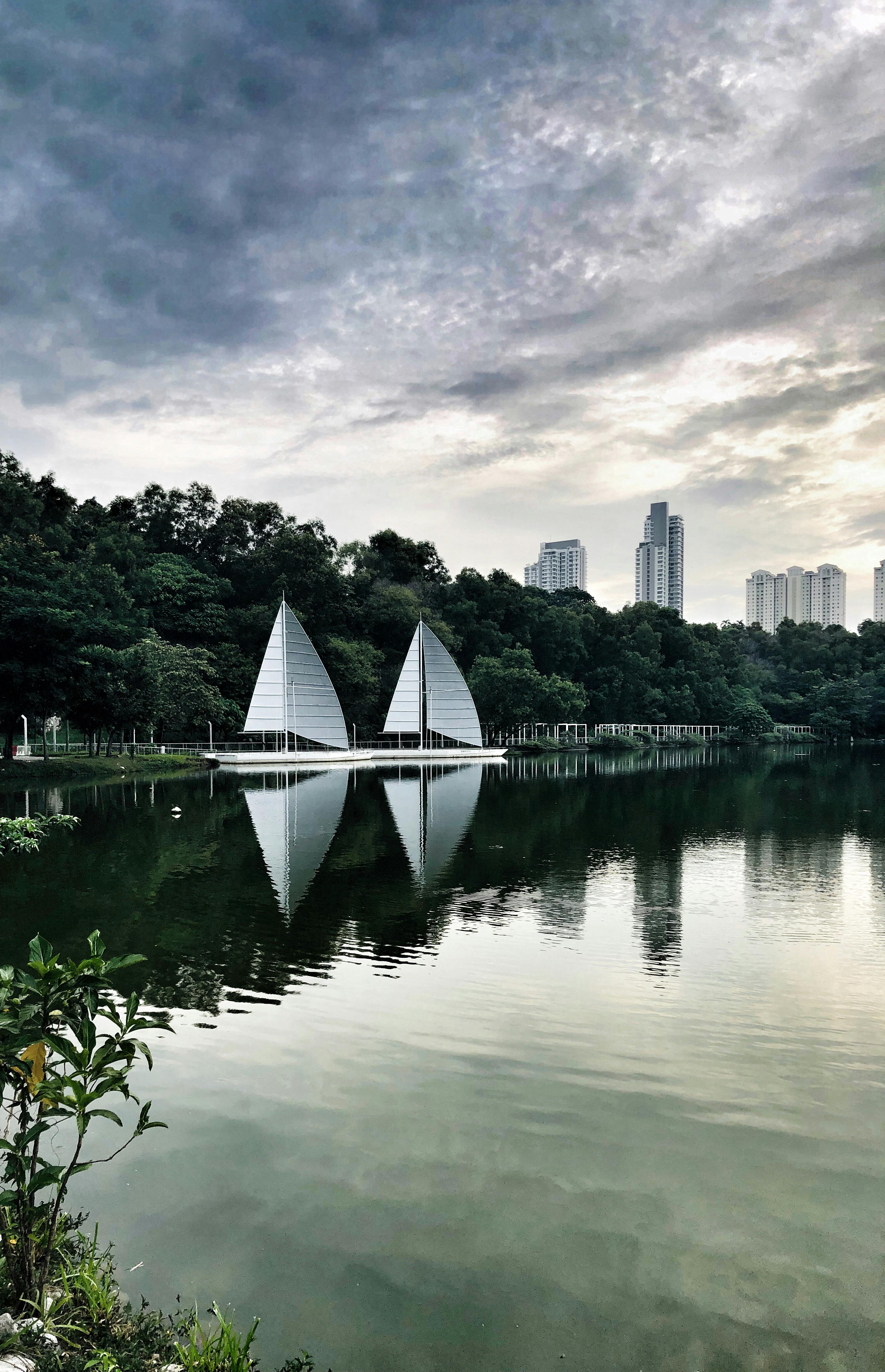People Riding on Boat while Sailing on the River · Free Stock Photo