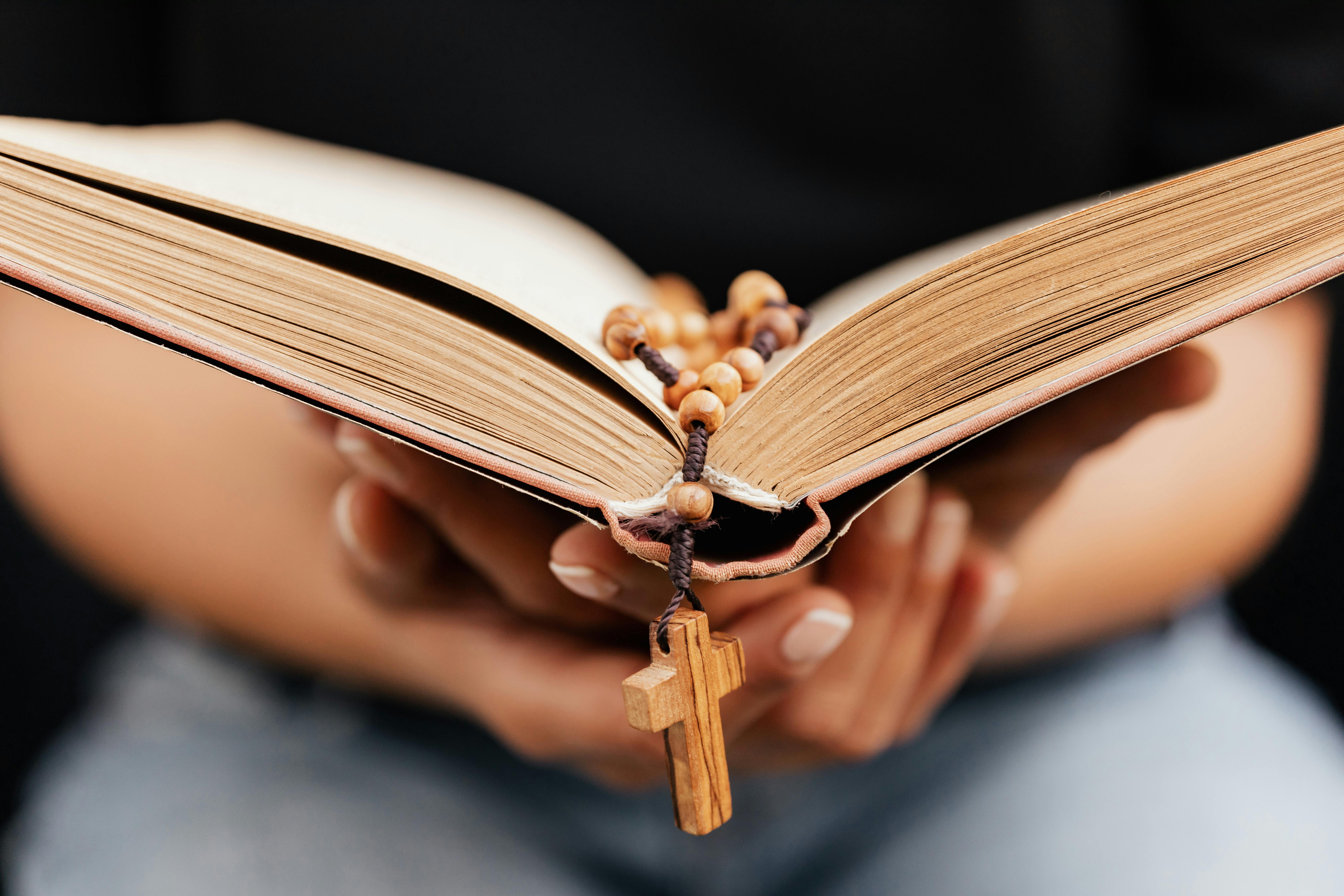 Close-Up Shot of a Person Reading a Bible · Free Stock Photo