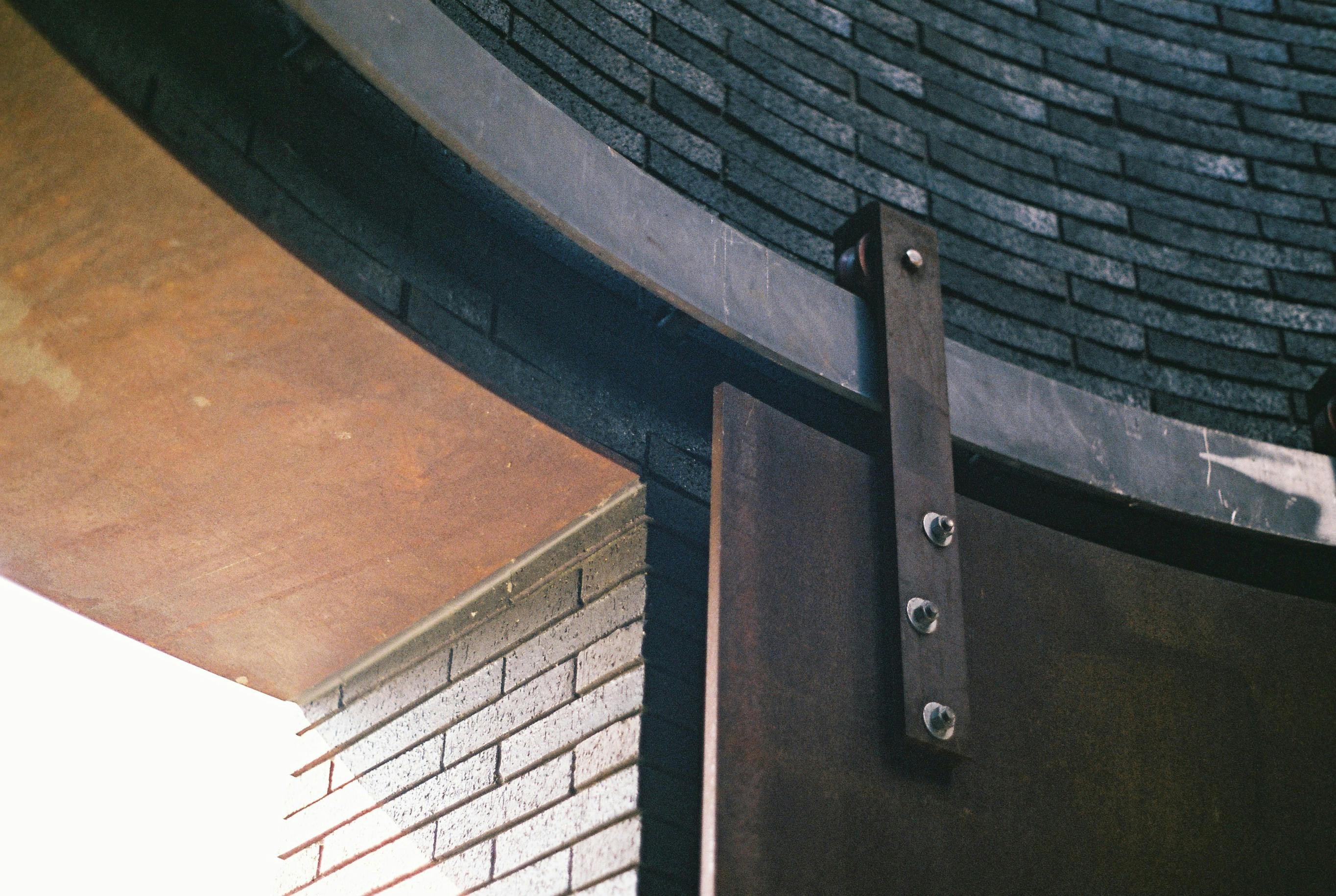 Metal gate rail on building · Free Stock Photo