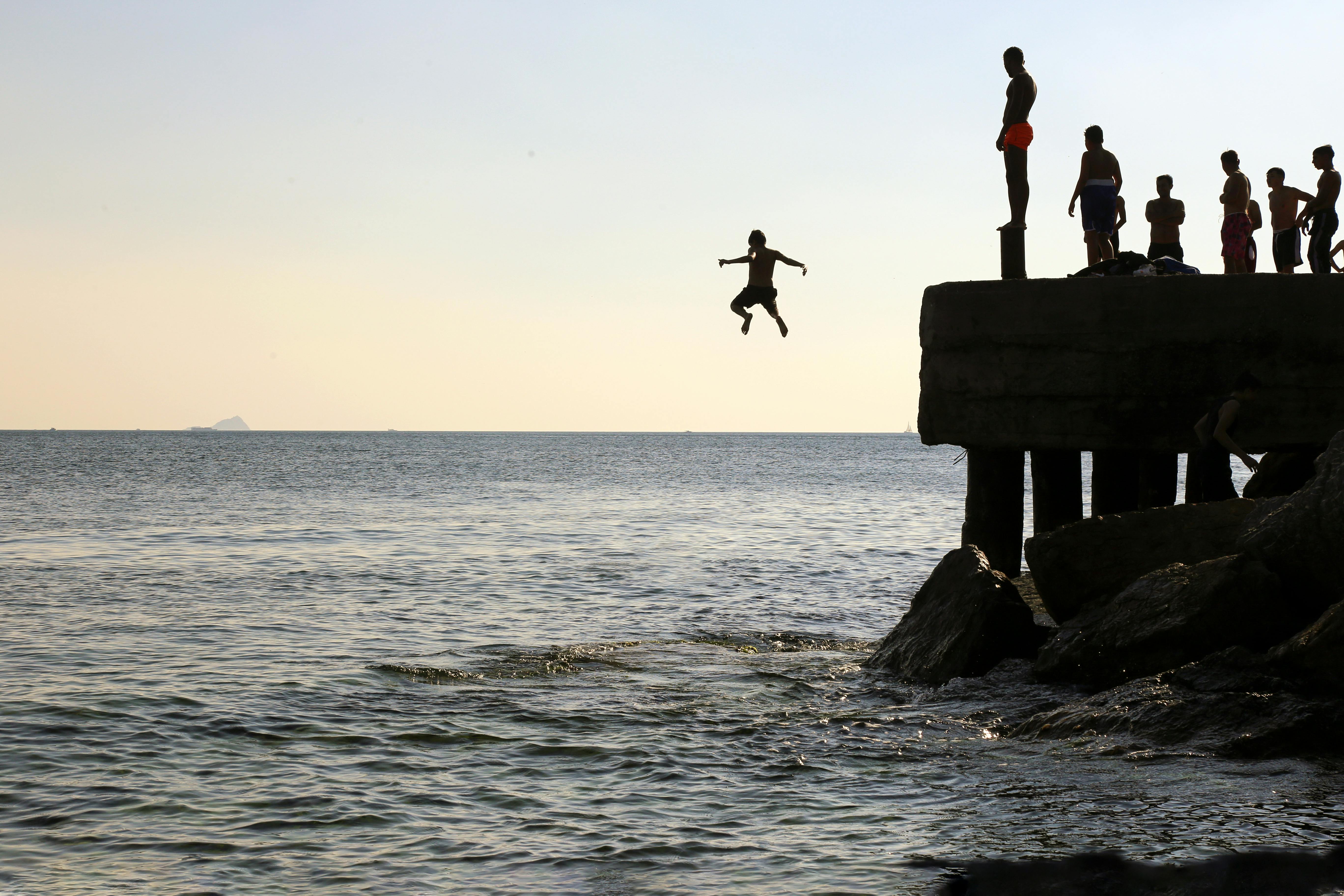 Person Jumping Off Cliff Silhouette