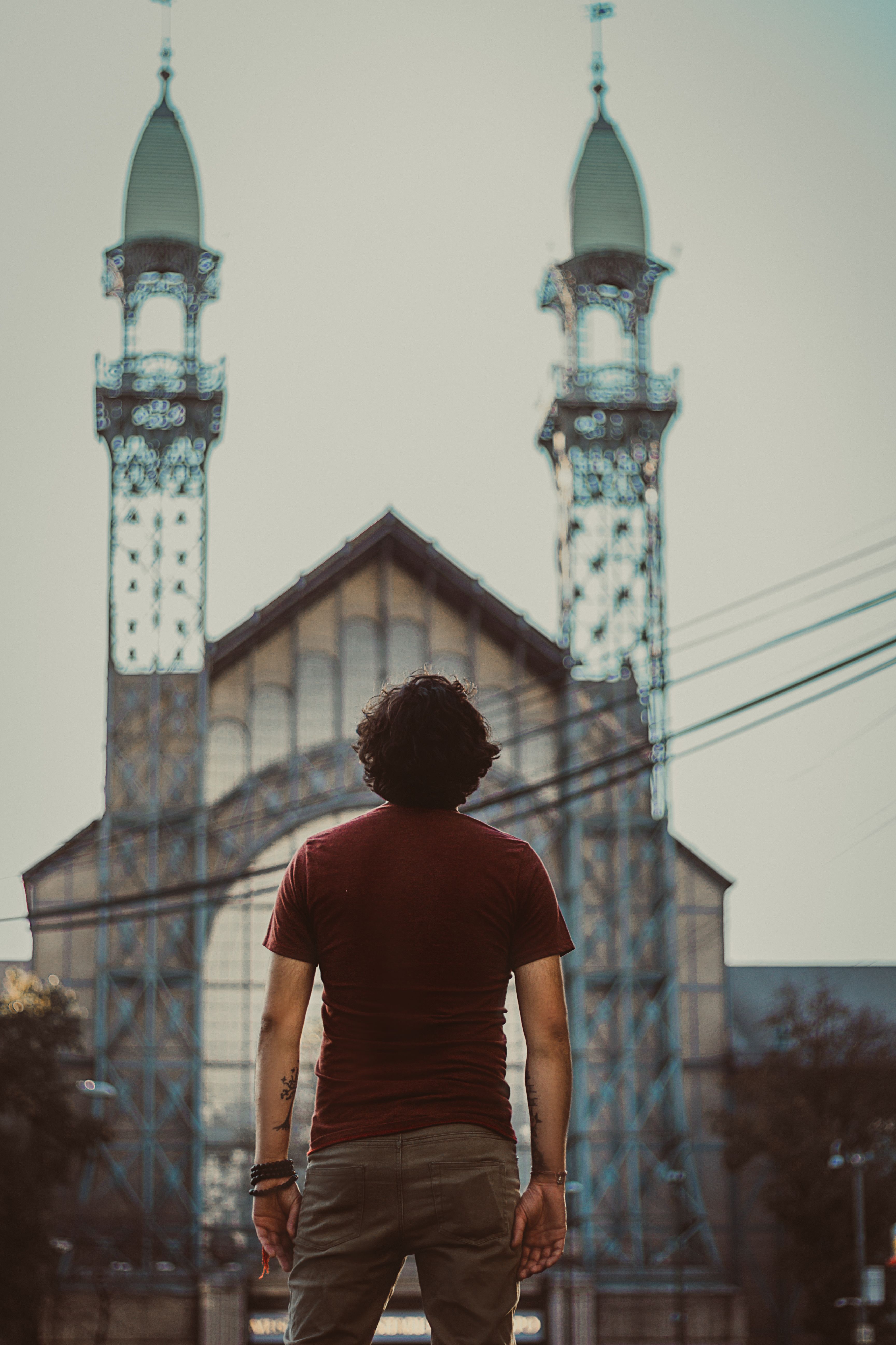 Back View of a Man Facing a Twin Tower · Free Stock Photo