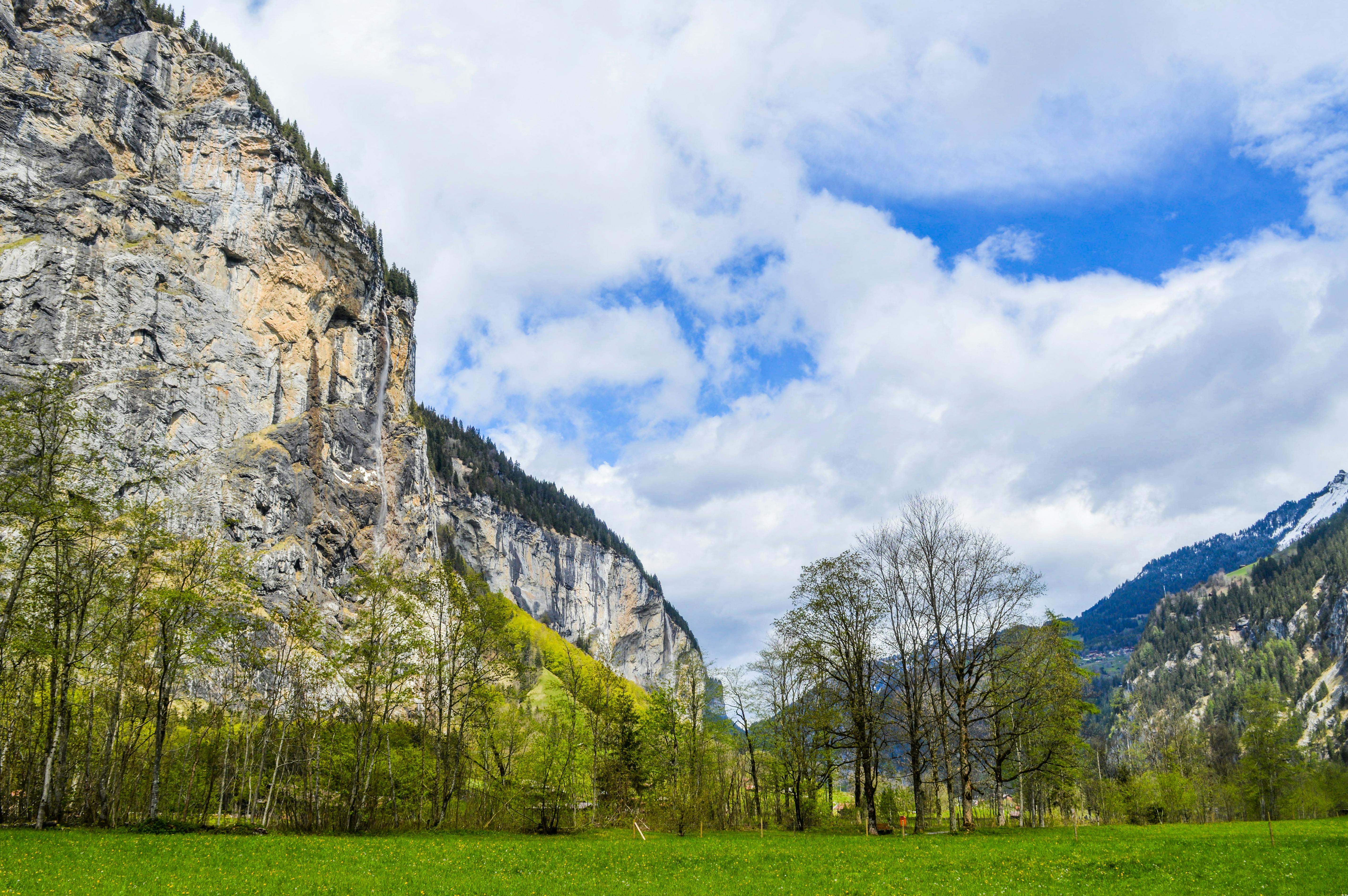 Steep mountain slope in valley with woods · Free Stock Photo