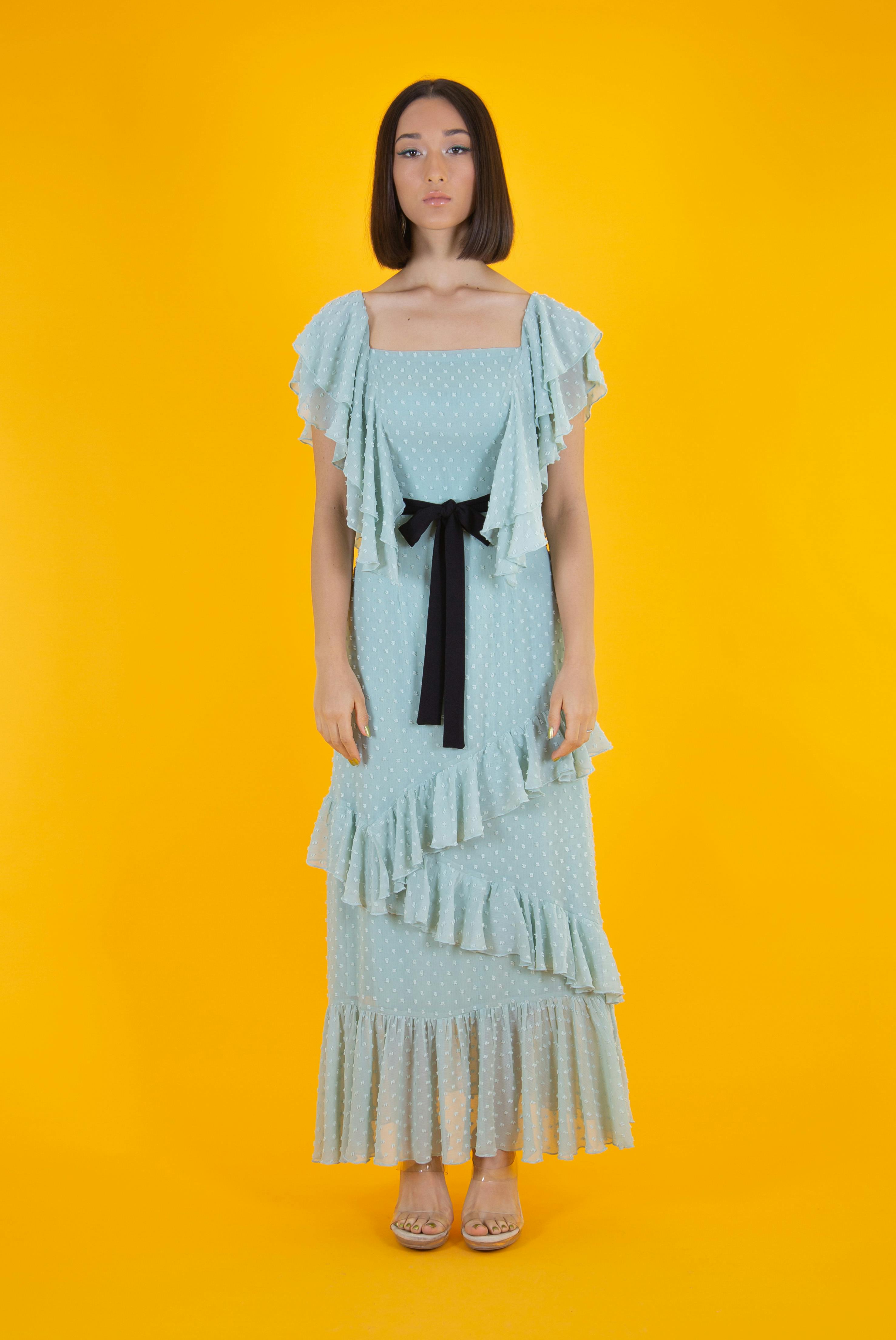 A Woman in Yellow Dress Under the Blue Sky · Free Stock Photo