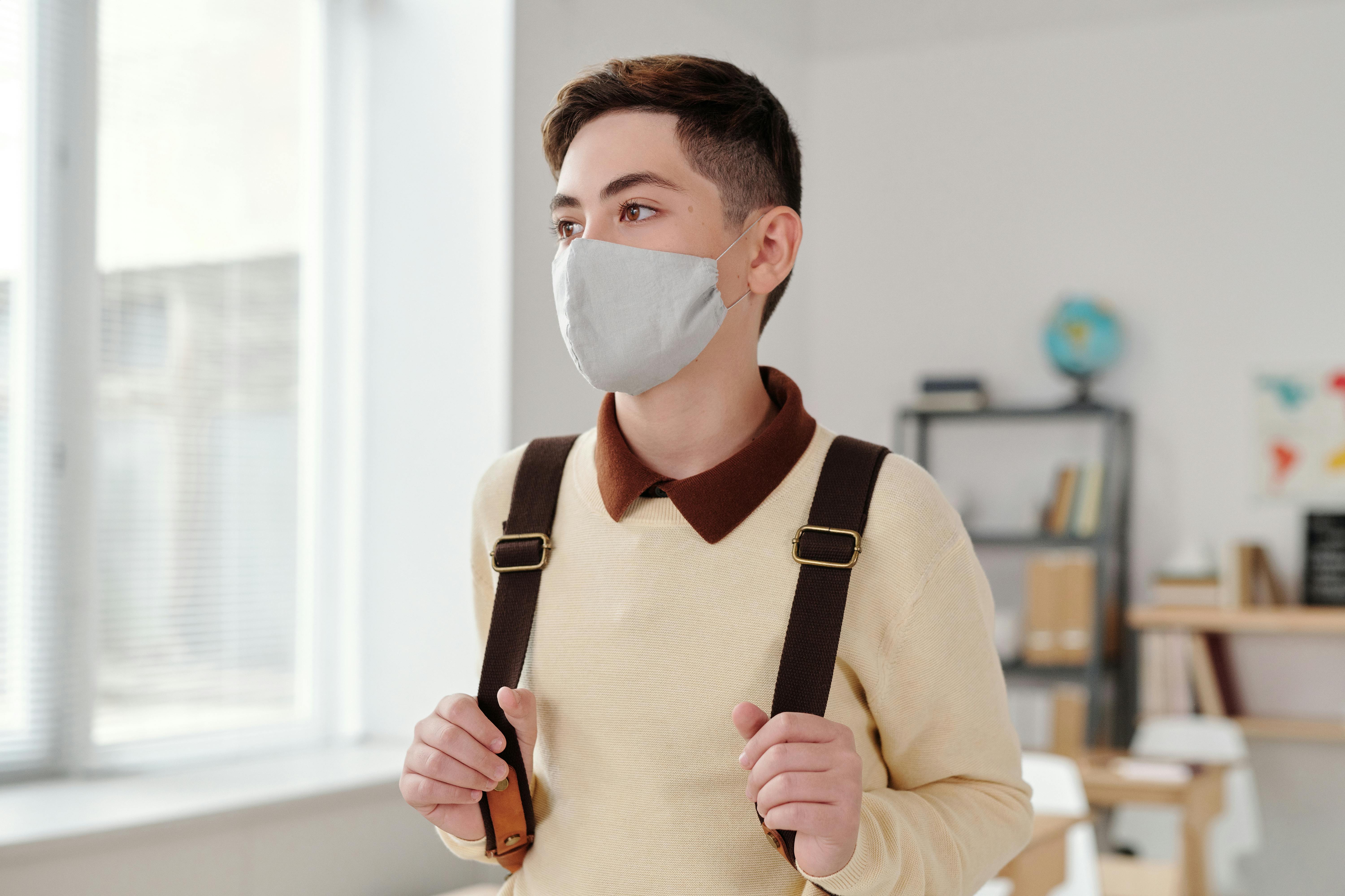 A Boy Wearing a Face Mask at School · Free Stock Photo
