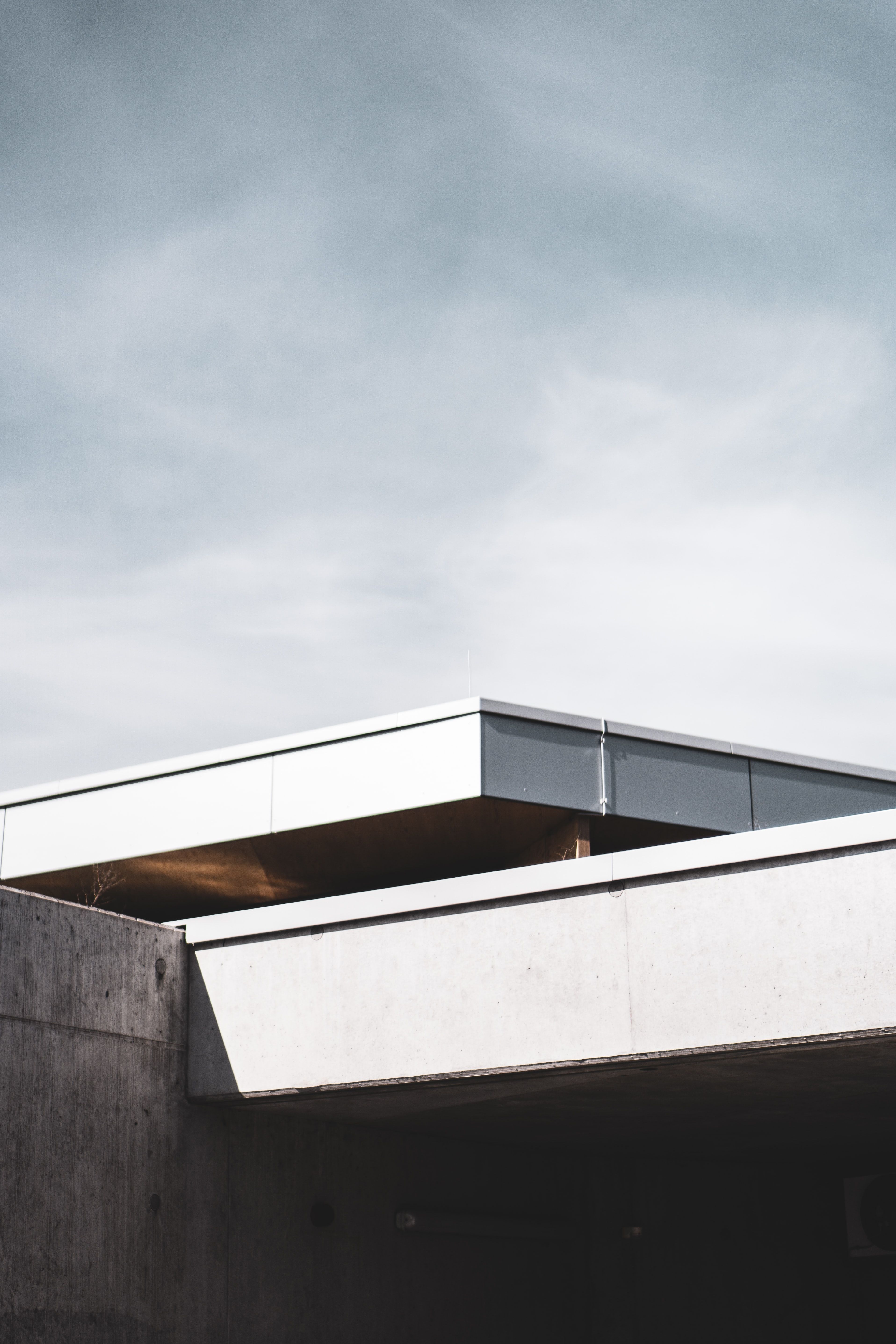 Sculpture on Roof behind Buildings · Free Stock Photo
