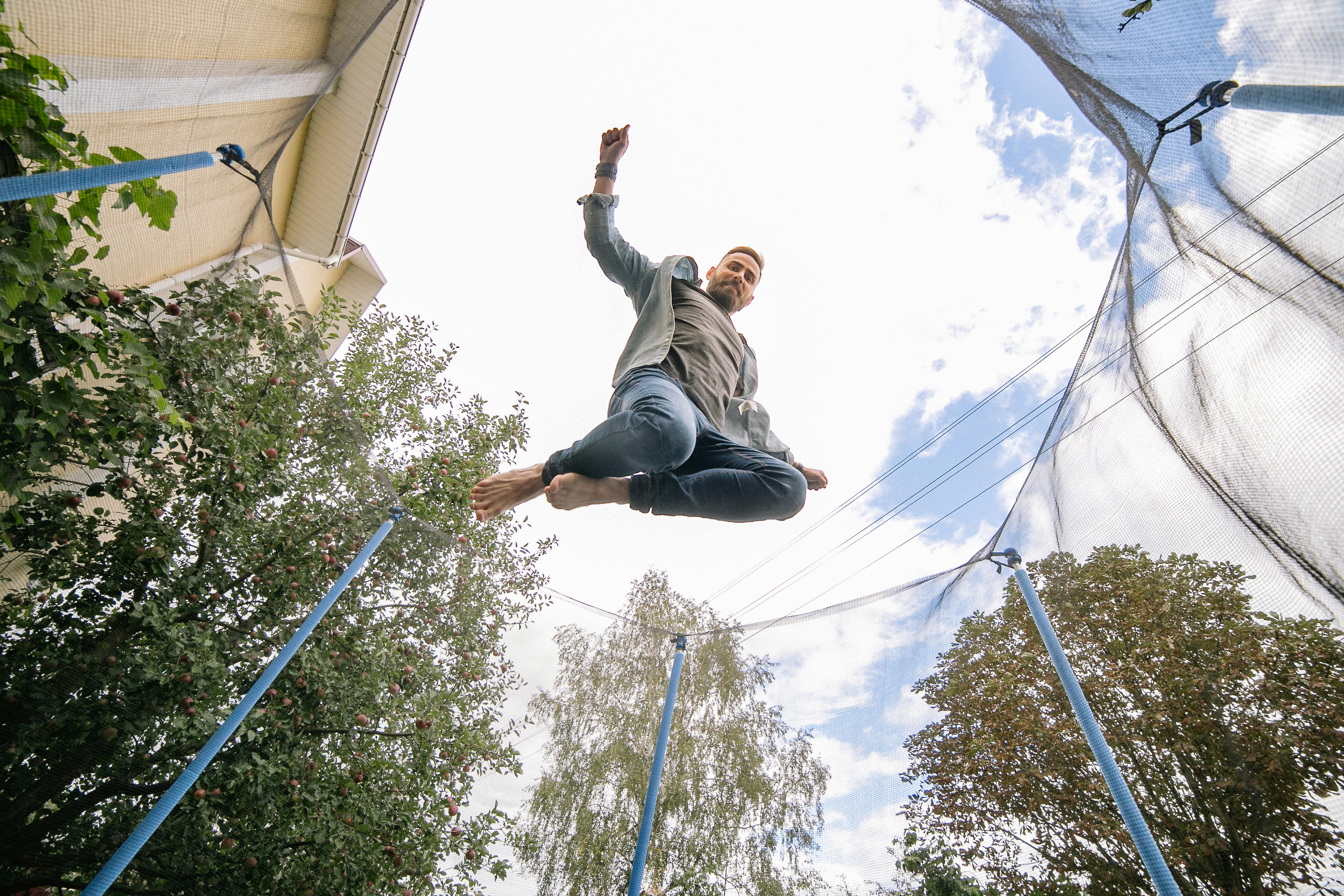 Low Angle Photography of Man Jumping · Free Stock Photo