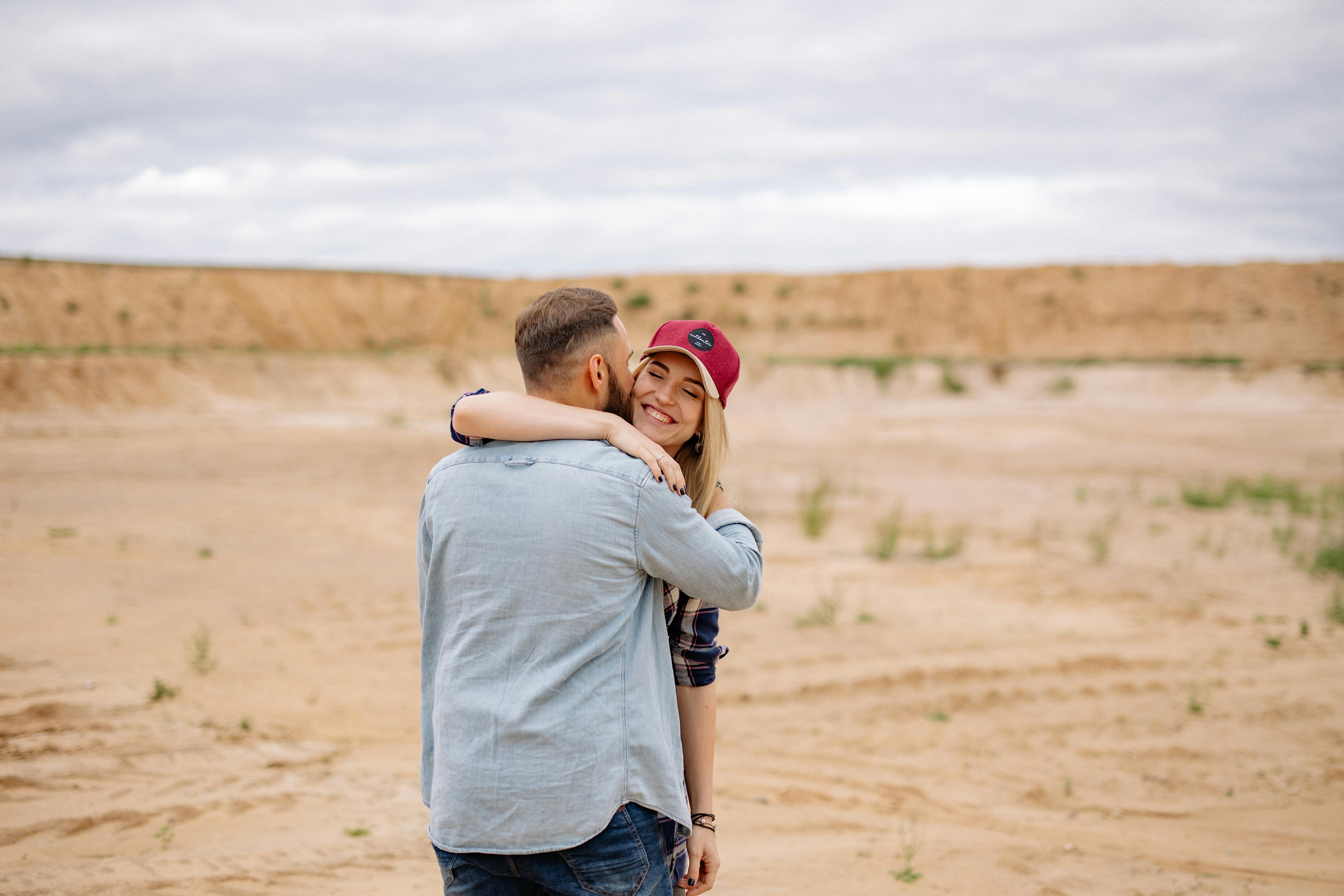 Couple Gazing Lovingly at Each Other in Sunny Park · Free Stock Photo