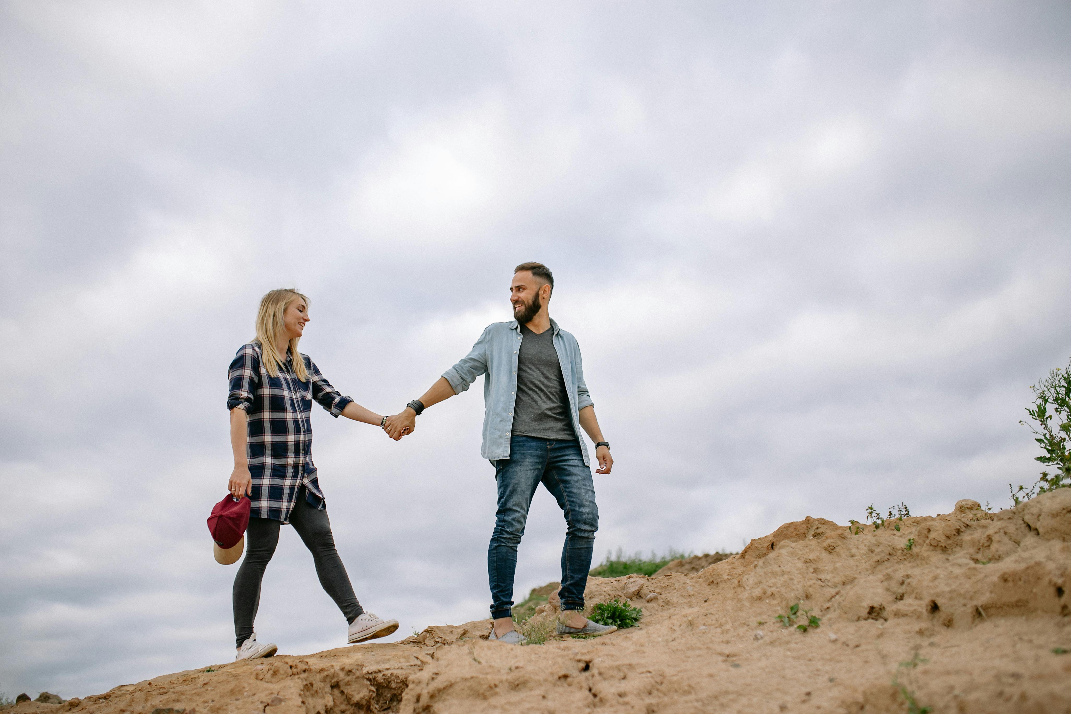 Couple Walking in City Holding Hands · Free Stock Photo