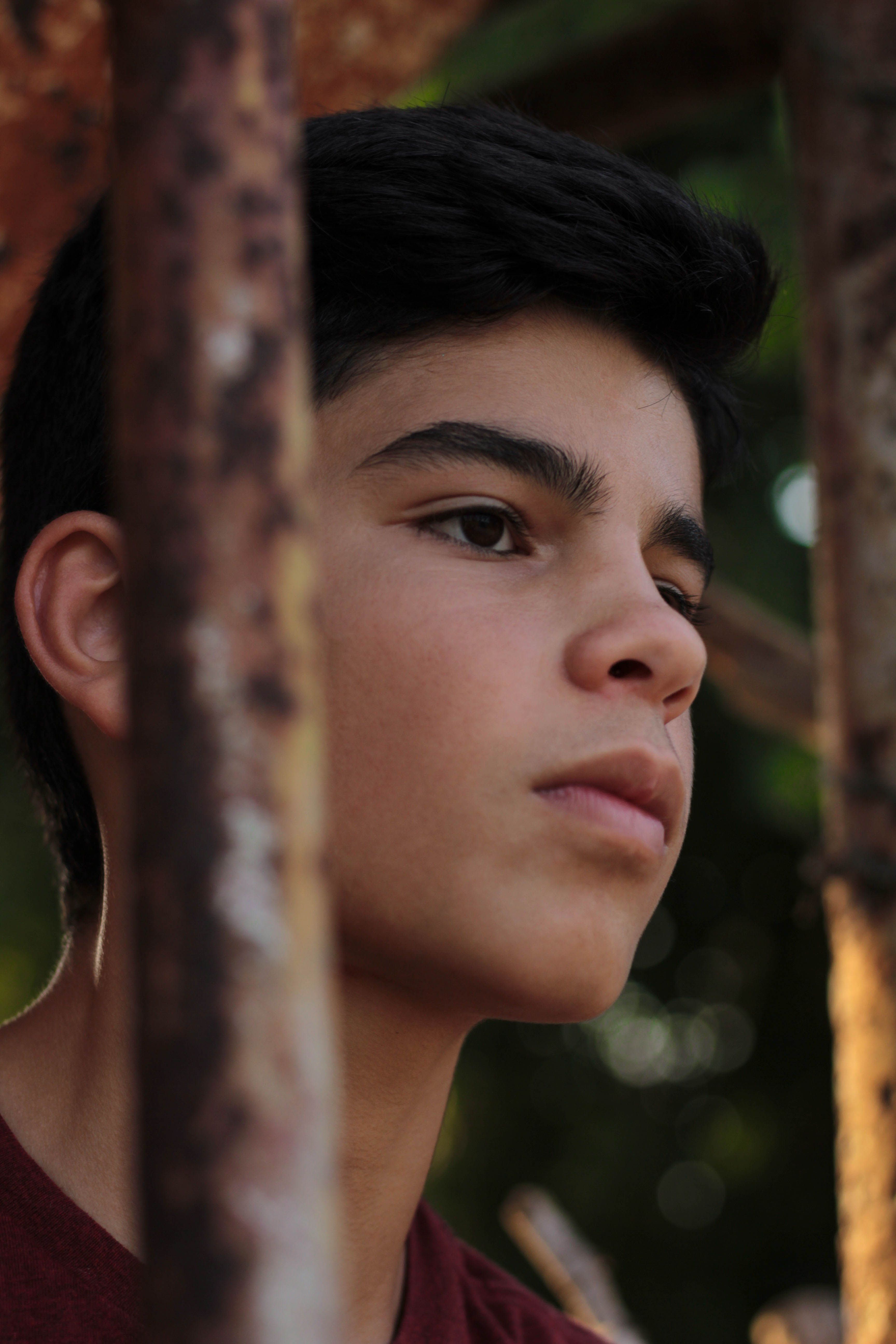 Good Looking Boy on Metal Bars · Free Stock Photo