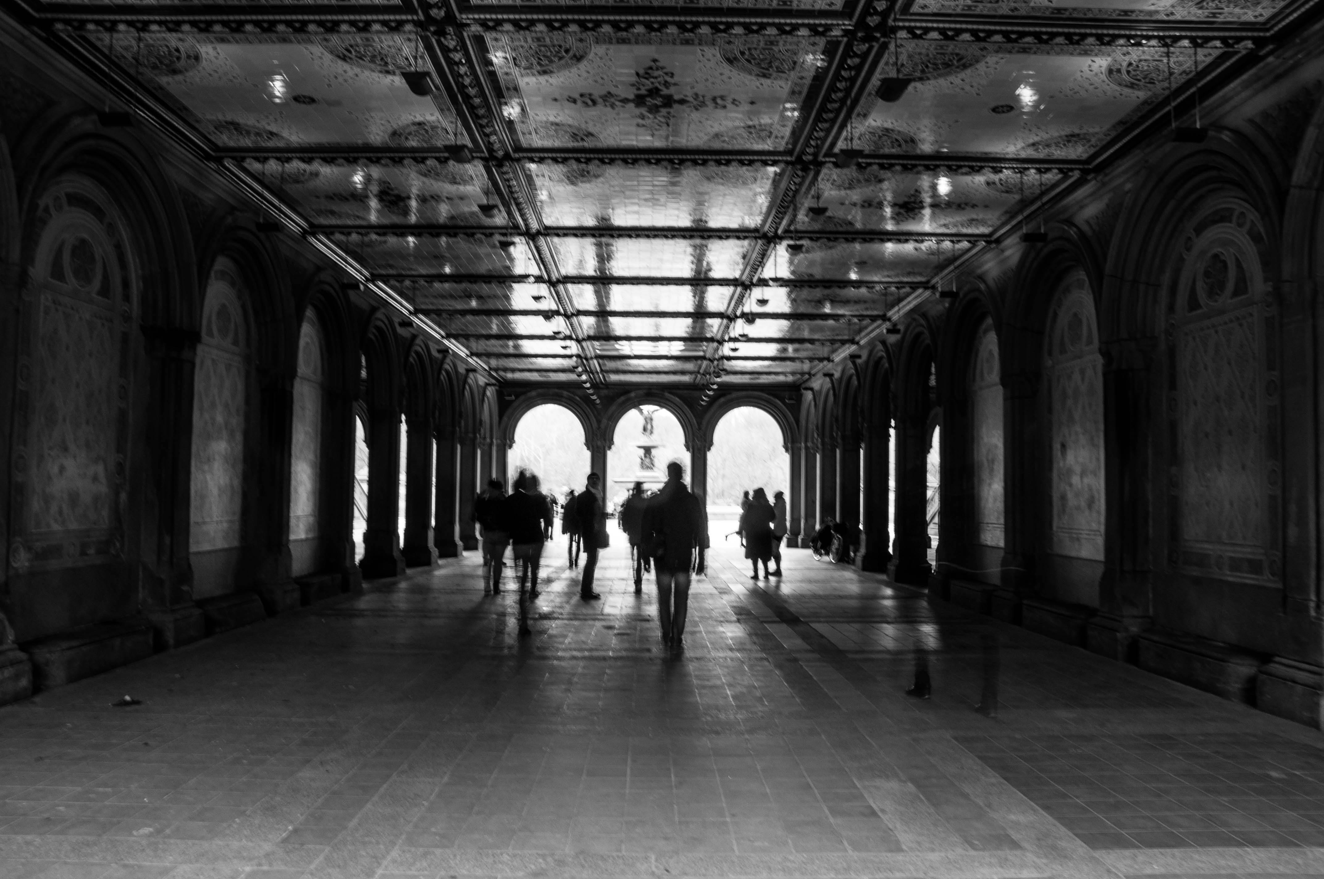 Grayscale Photo of People Walking on Hallway · Free Stock Photo