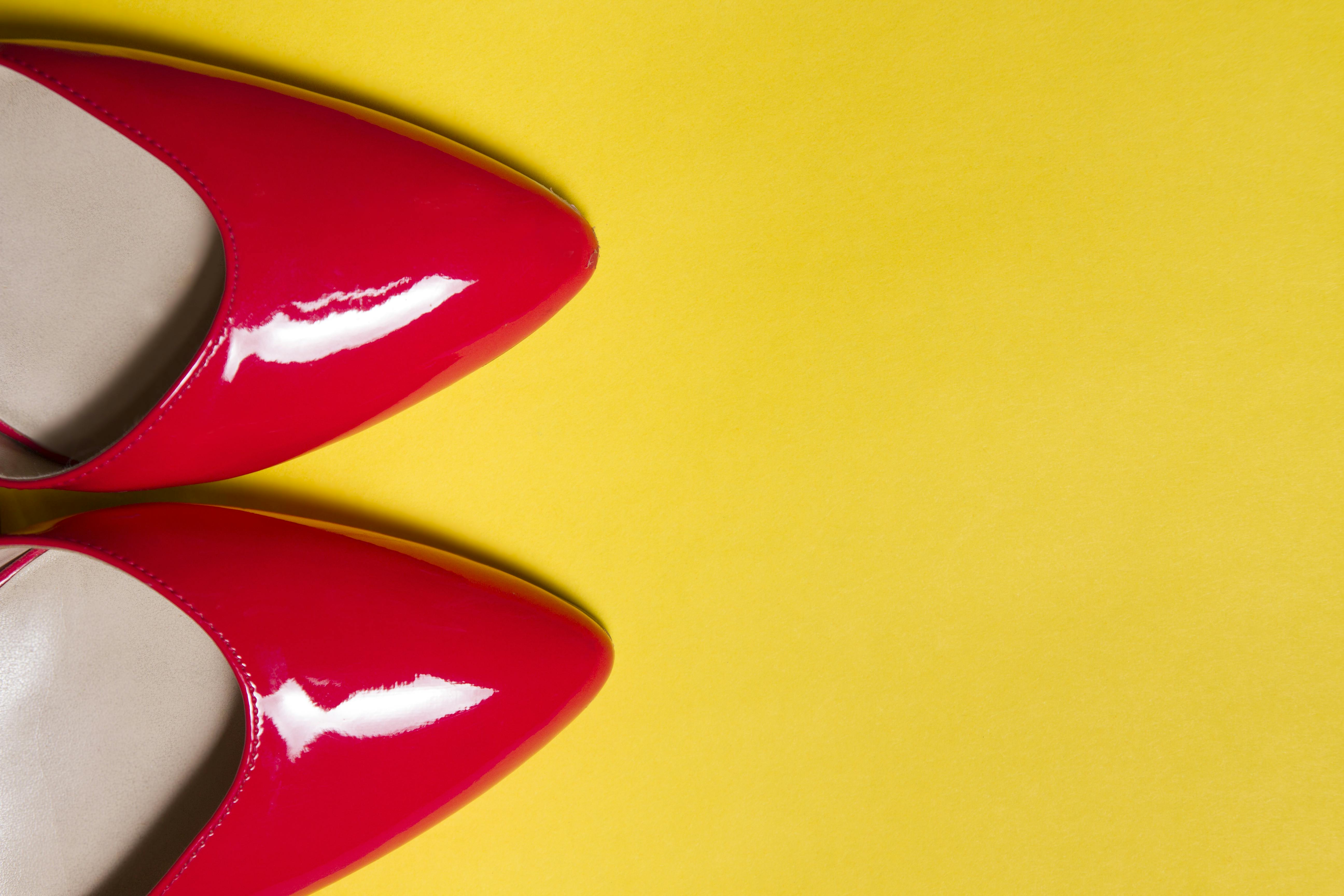 Red Heels on Yellow Studio Background · Free Stock Photo