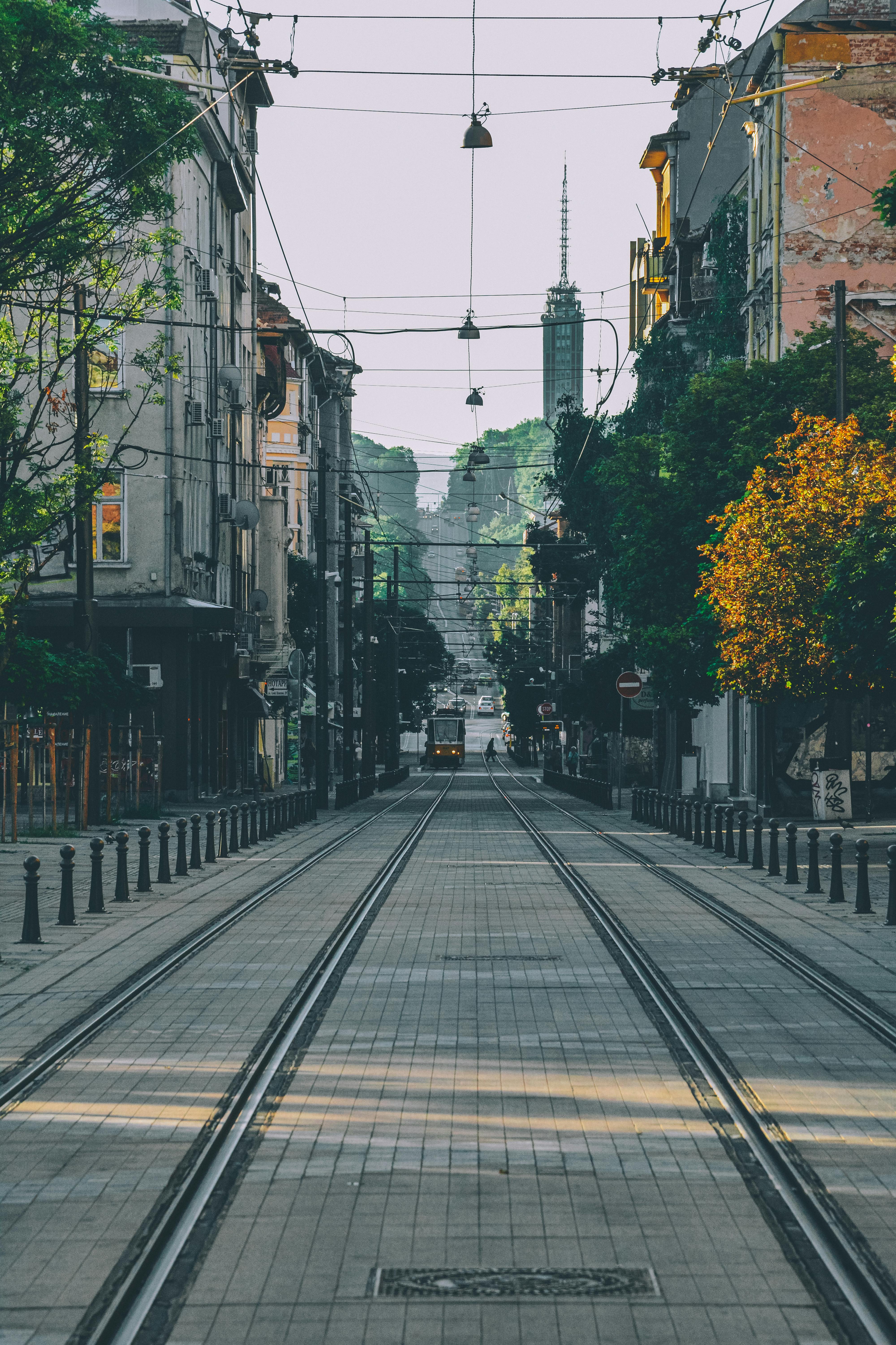 Train Rail in Between Buildings · Free Stock Photo