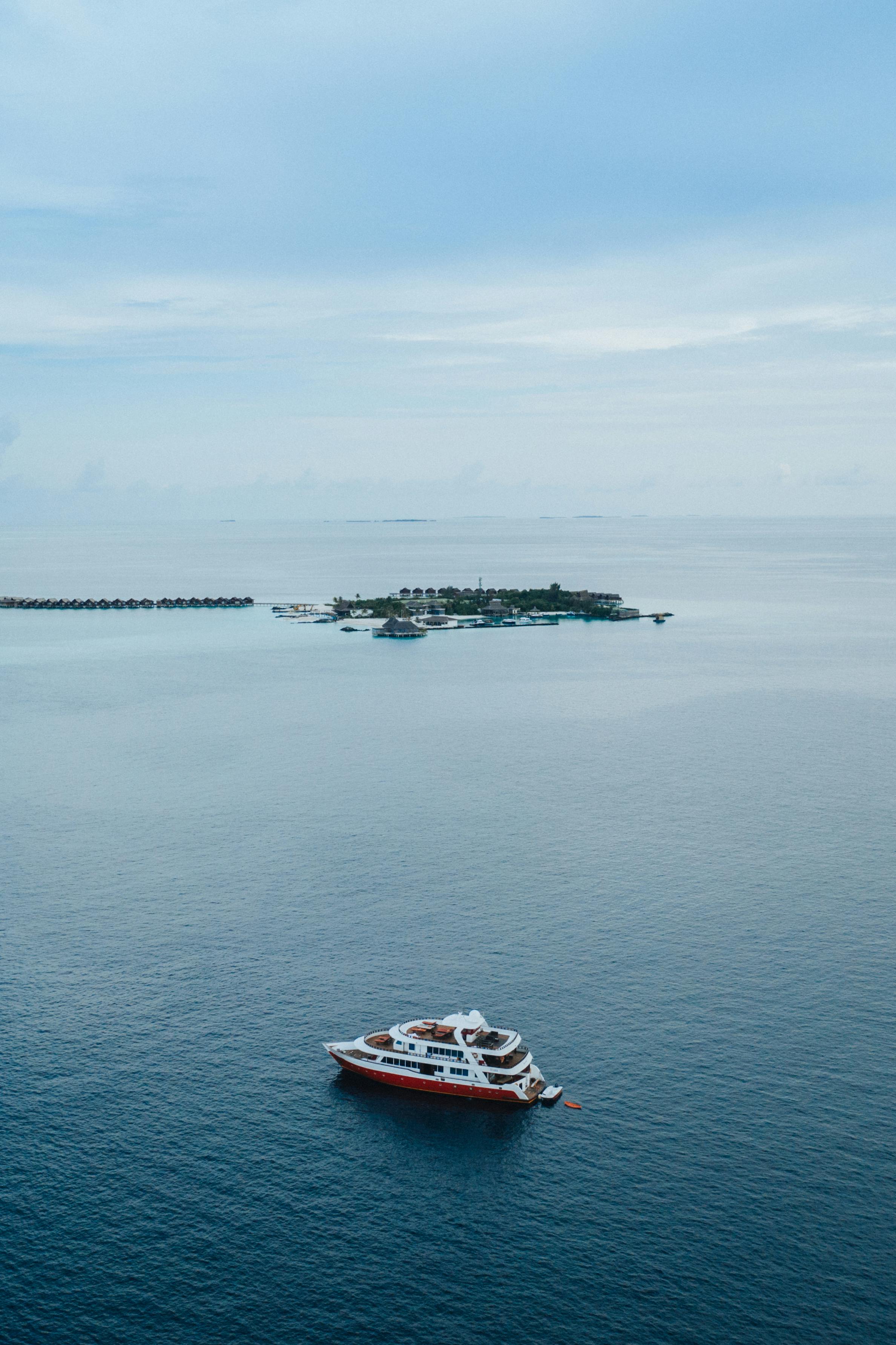 Cruise ship sailing in ocean on sunny day · Free Stock Photo