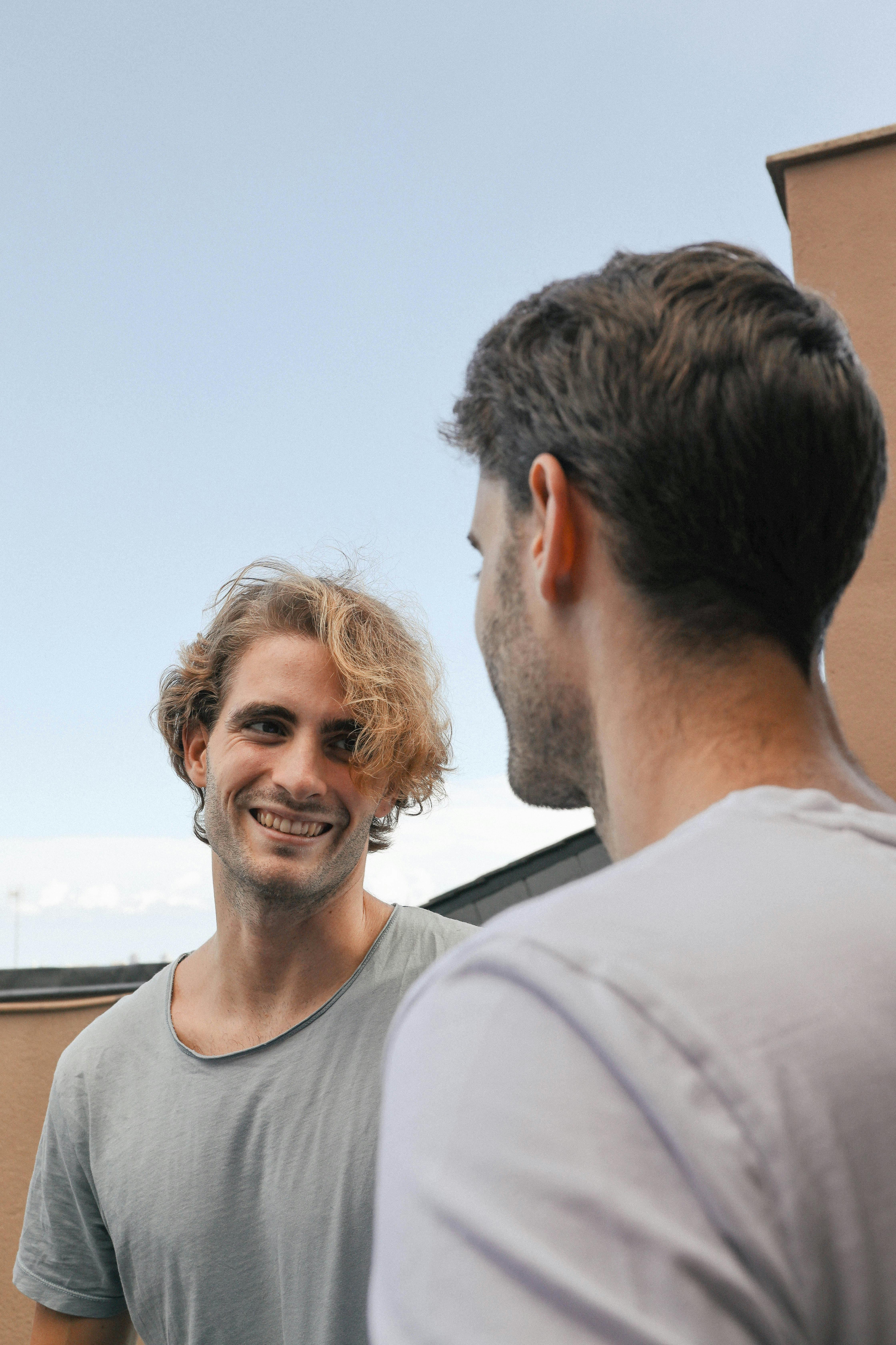 Two Men Talking Together · Free Stock Photo