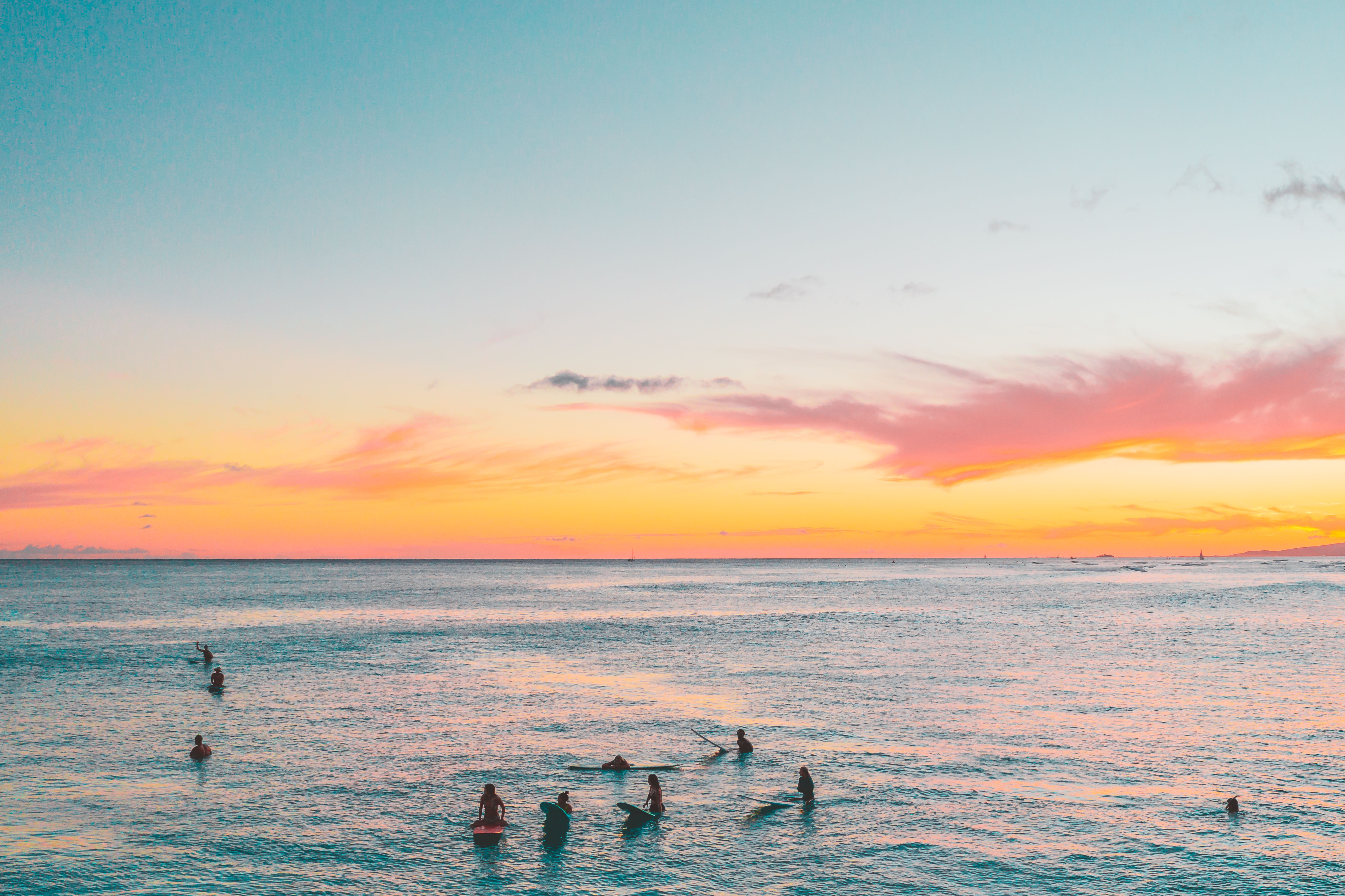 People Swimming on the Sea during Sunset · Free Stock Photo