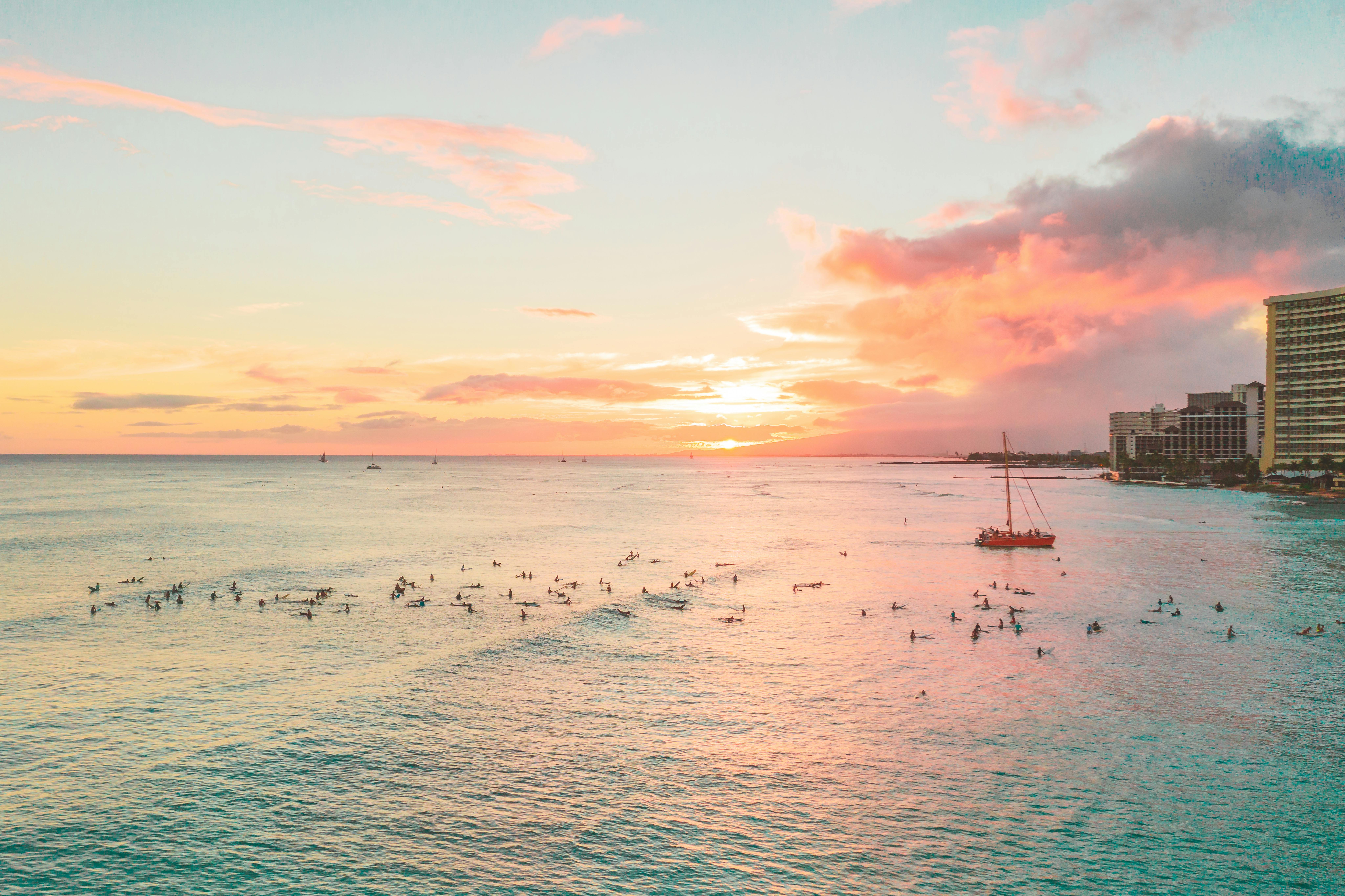 View of a People on the Sea during Sunset · Free Stock Photo