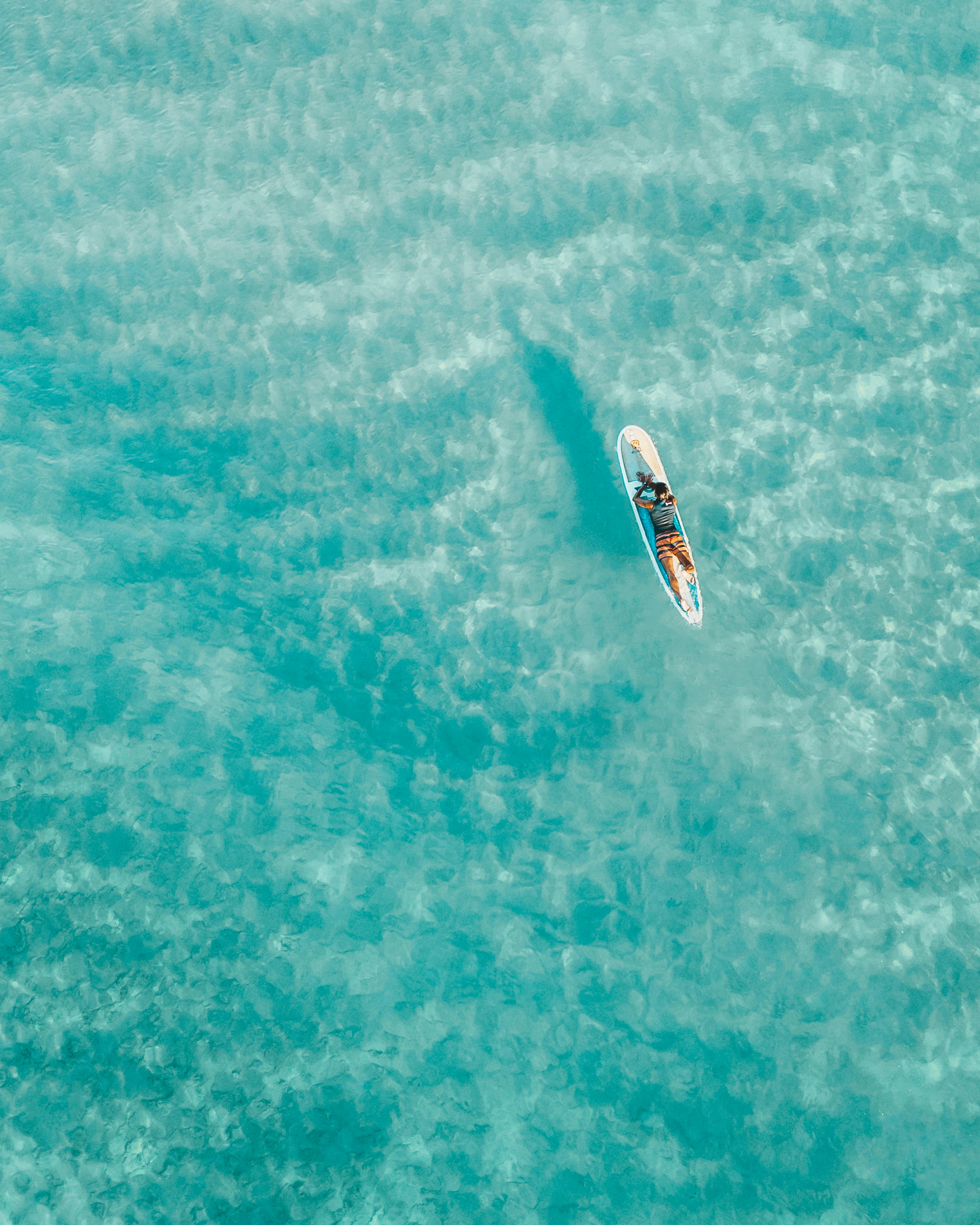 Person on Surfboard on Blue Sea · Free Stock Photo