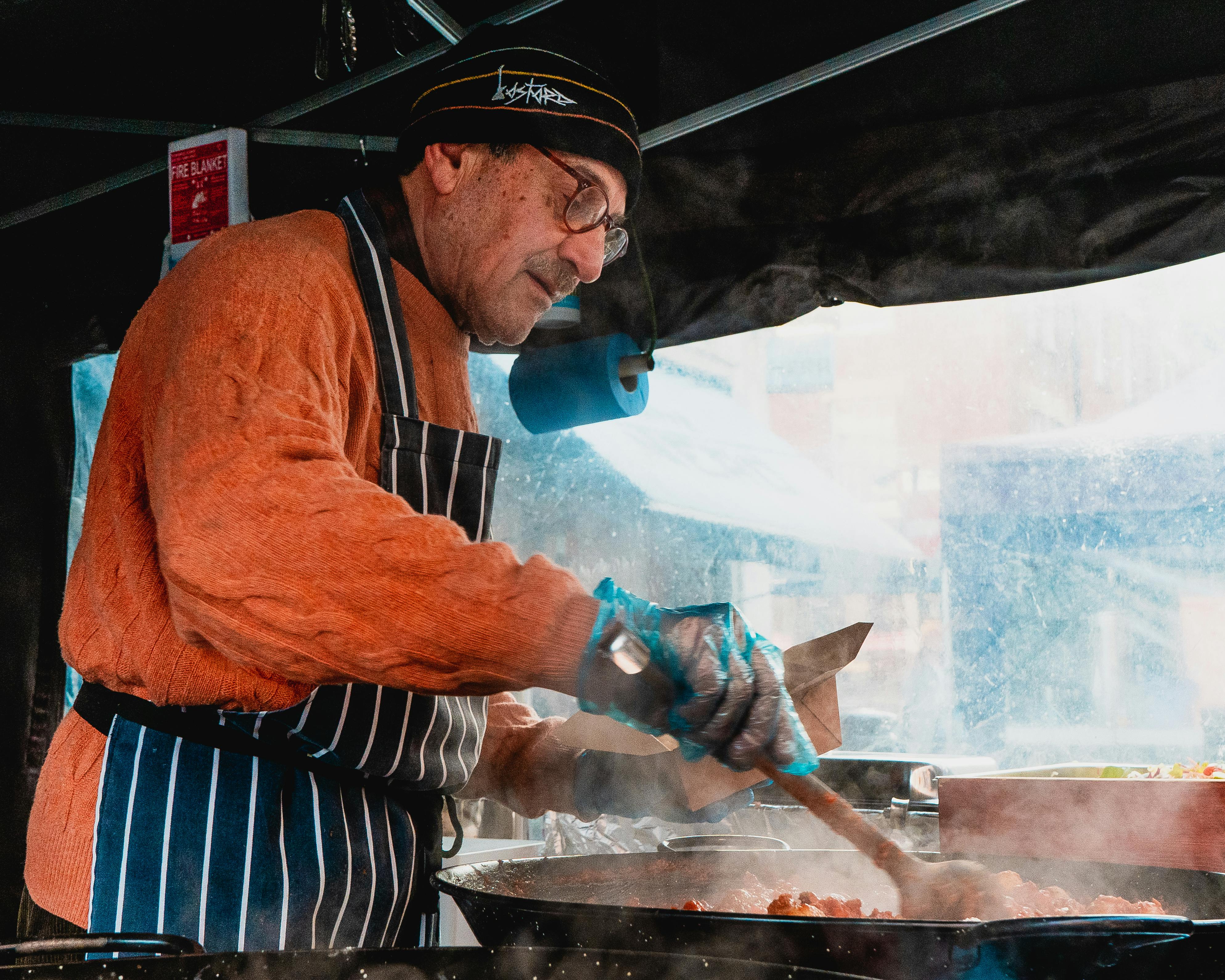 A Chef Busy Cooking · Free Stock Photo