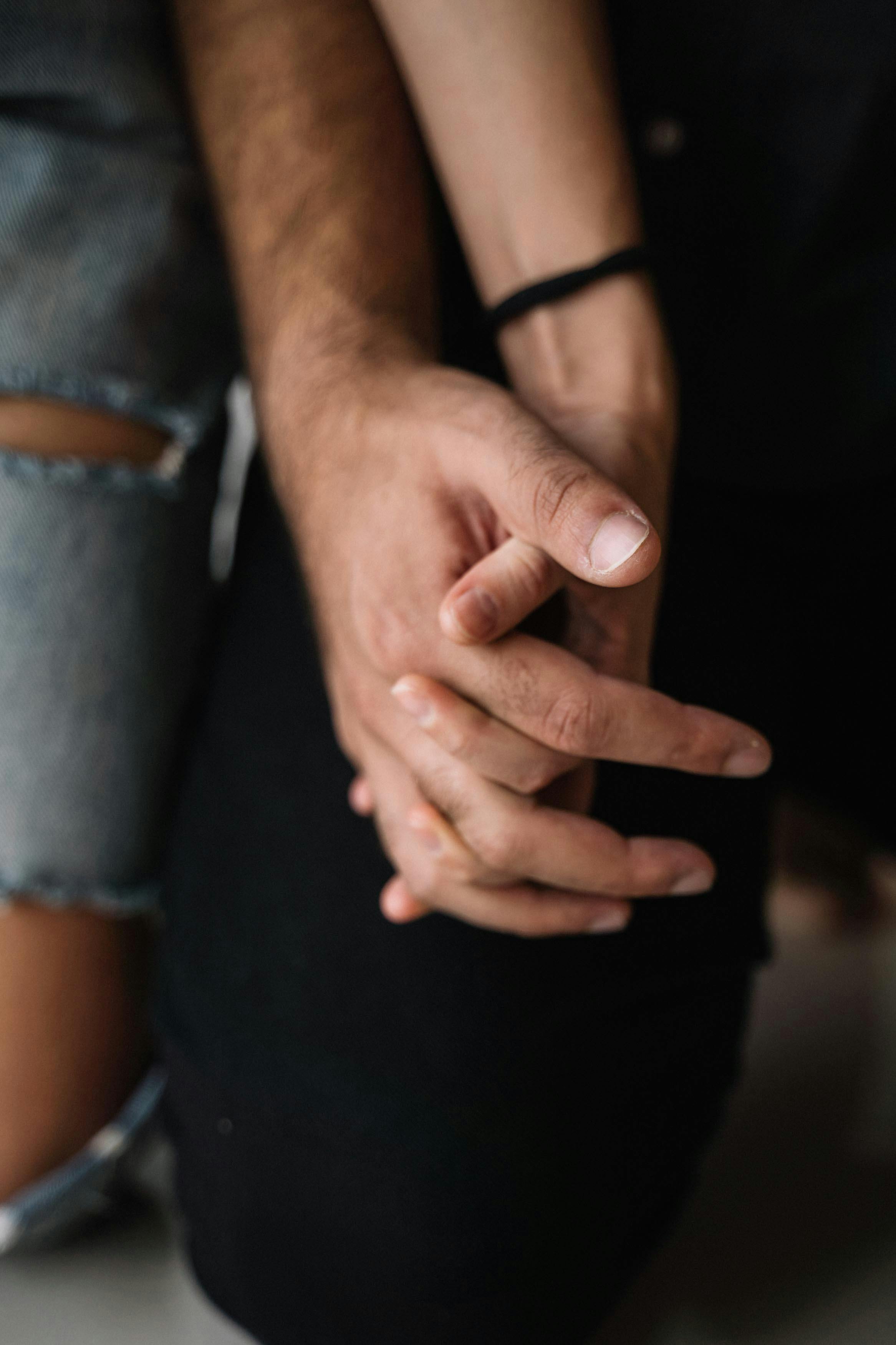 Close Up Photo of People Holding Hands · Free Stock Photo