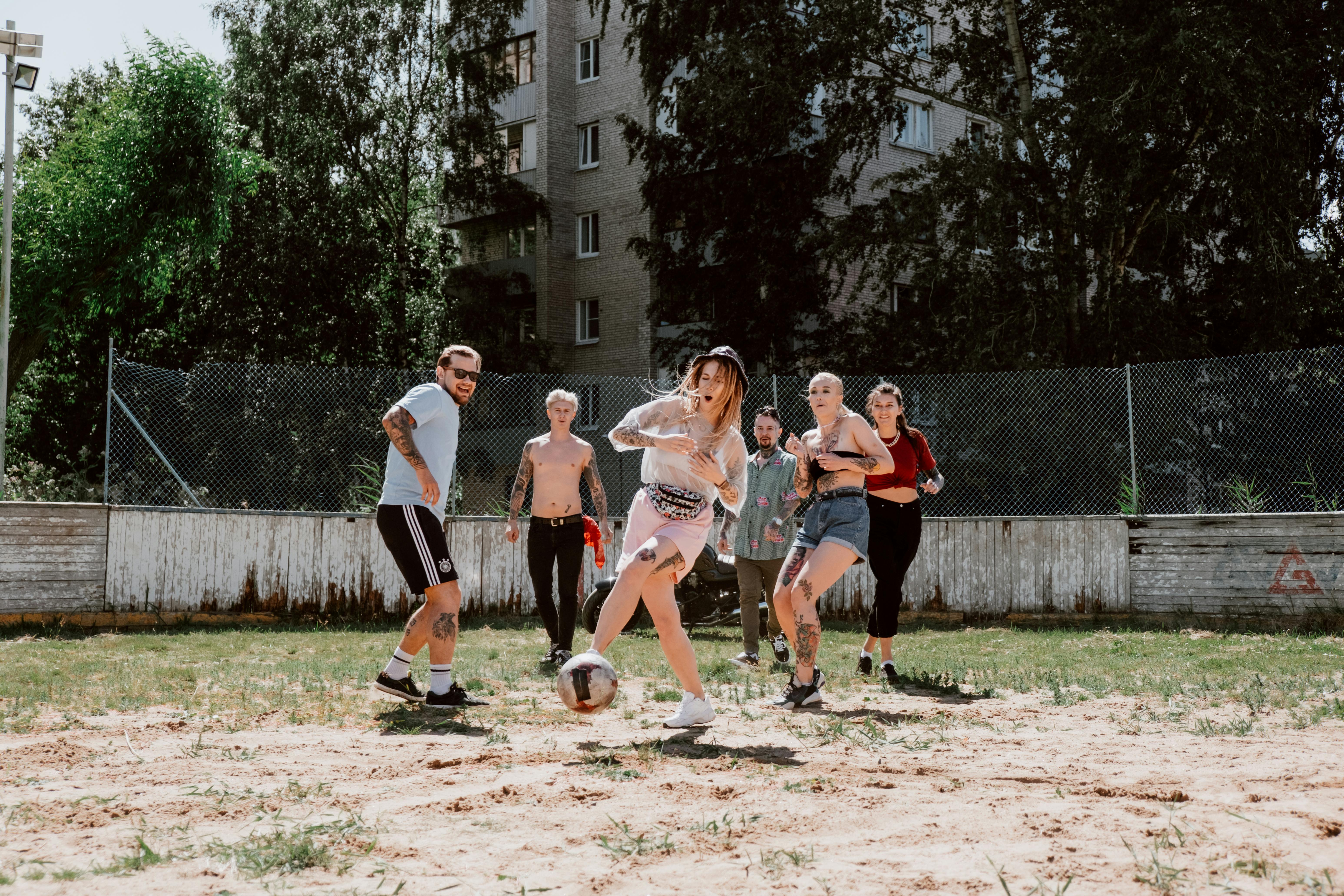 Group of Friends Playing Soccer · Free Stock Photo