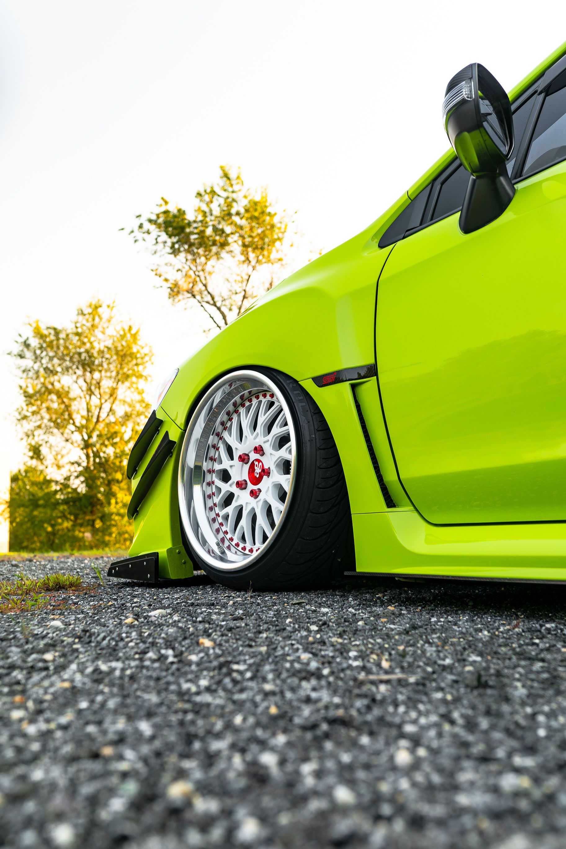 Low Angle View of Neon Green Car · Free Stock Photo
